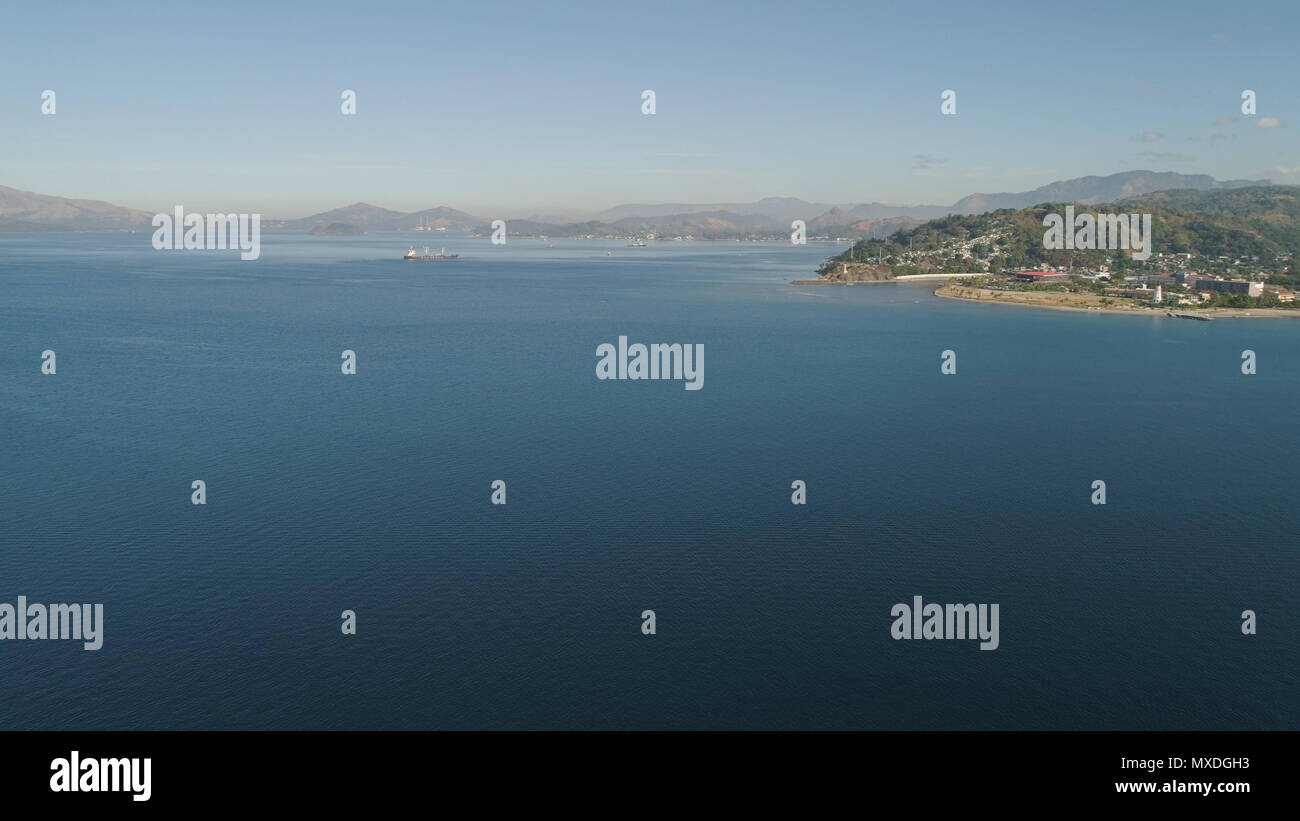 Aerial view: Cargo, Reefer ship in the sea bay. Subic Bay, Philippines ...