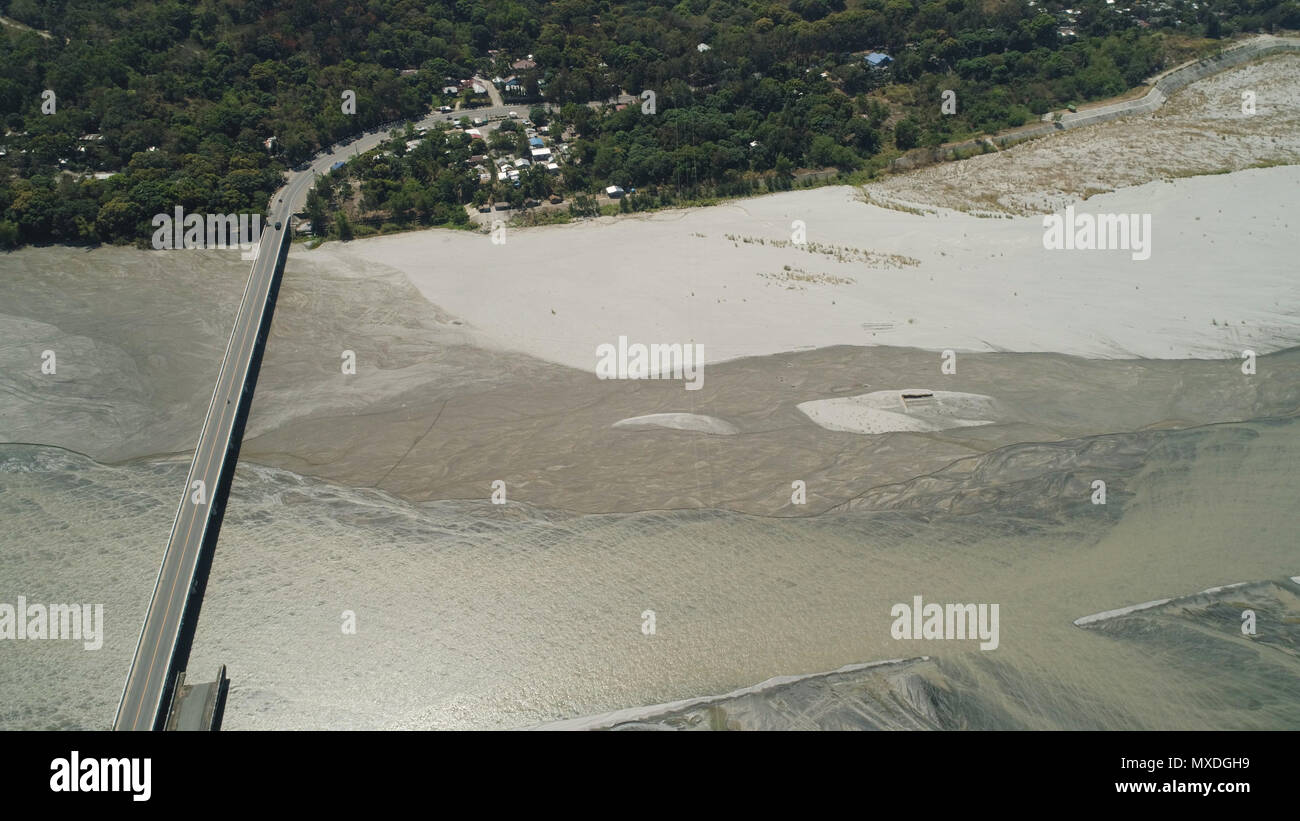 Modern bridge over river with cars in a mountain province Philippines ...