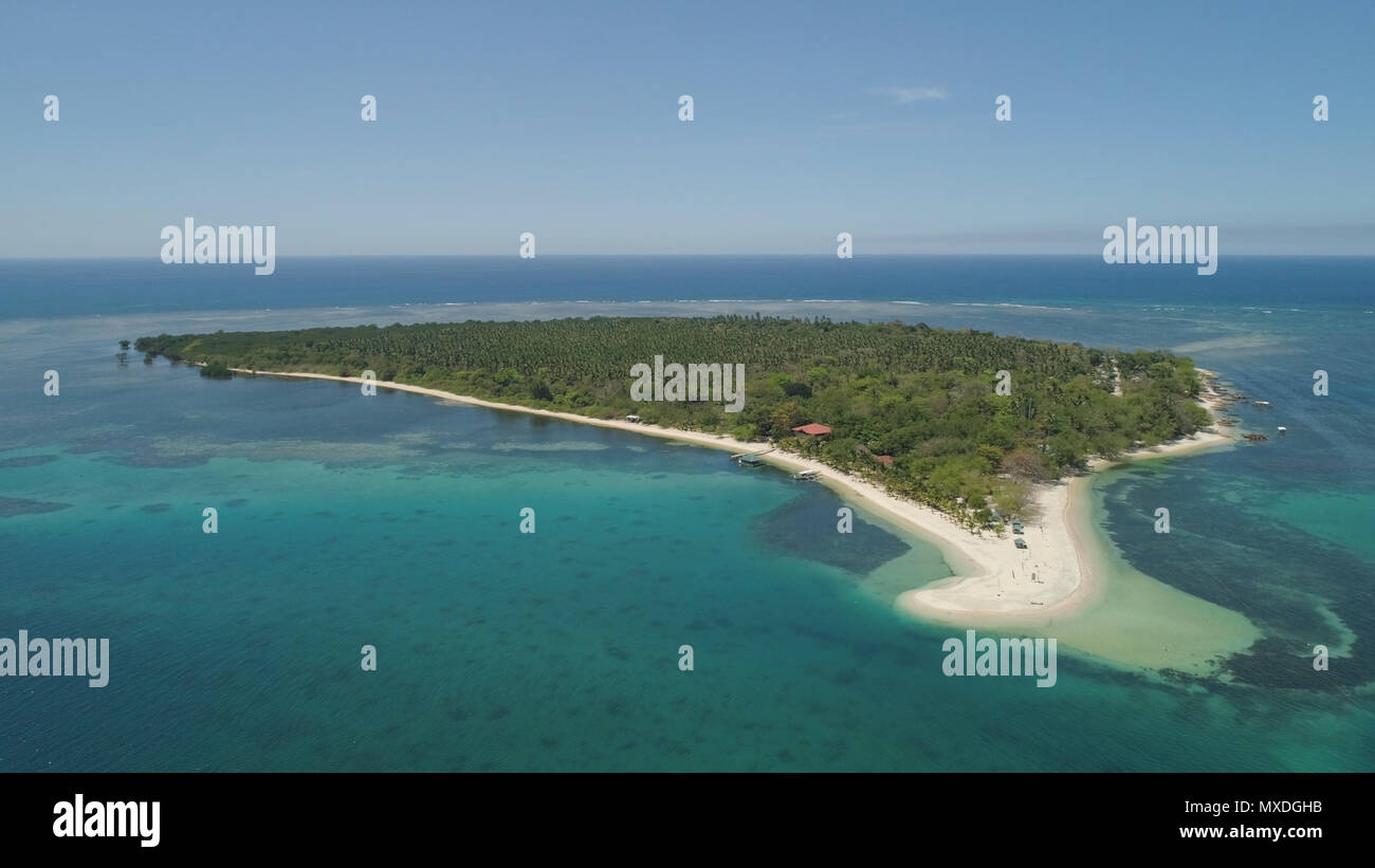 Tropical island with white sandy beach. Aerial view: Magalawa island ...