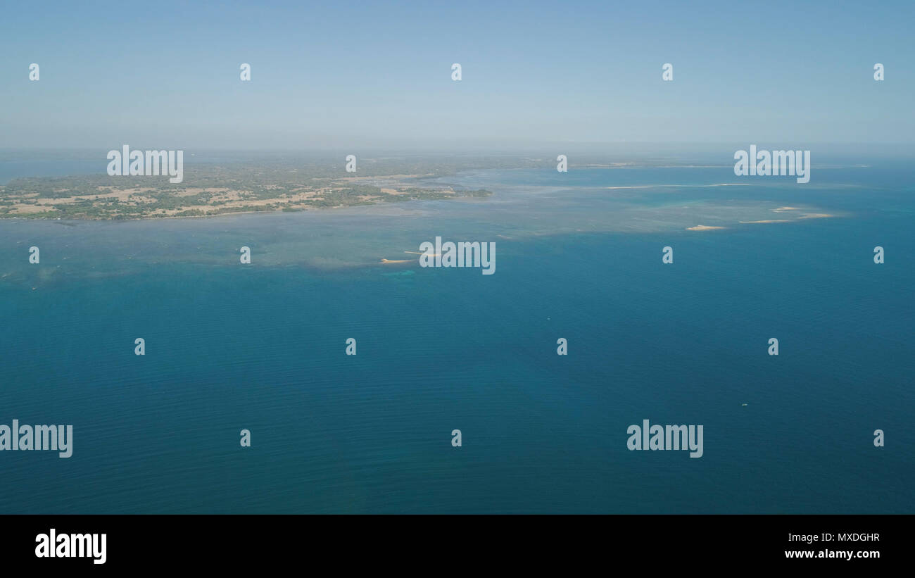 Aerial view of water surface, sandy islands in blue water, coast ...