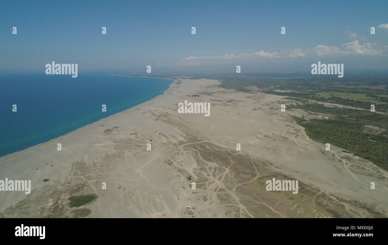 Aerial view of beautiful lonely beach and Paoay sand dune. Philippines ...
