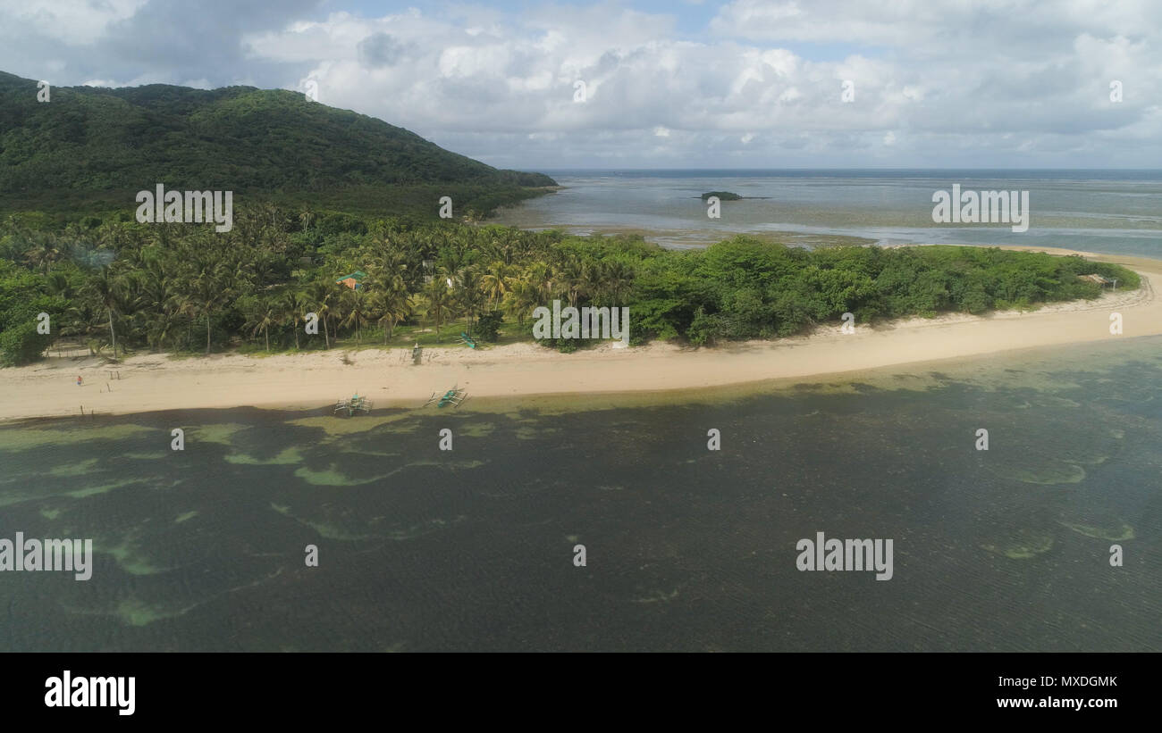 Aerial view of beautiful tropical beach with turquoise water in blue ...