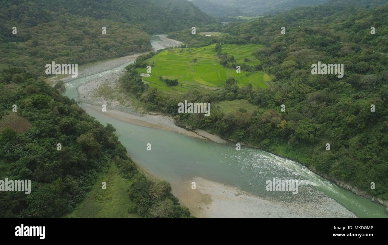 Aerial view of mountain valley in the cordillera, river, rice terraces ...
