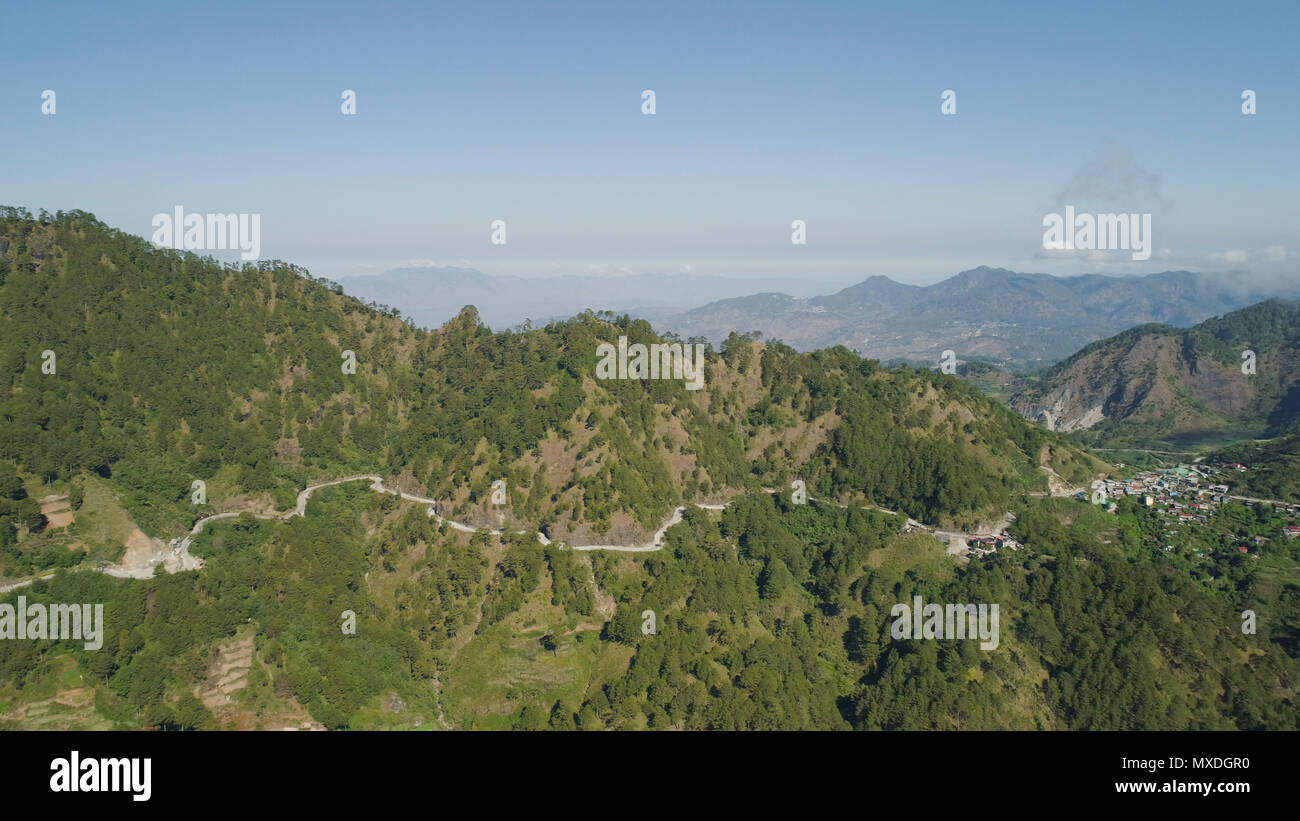 Aerial view of mountains covered forest, trees in clouds. Cordillera ...
