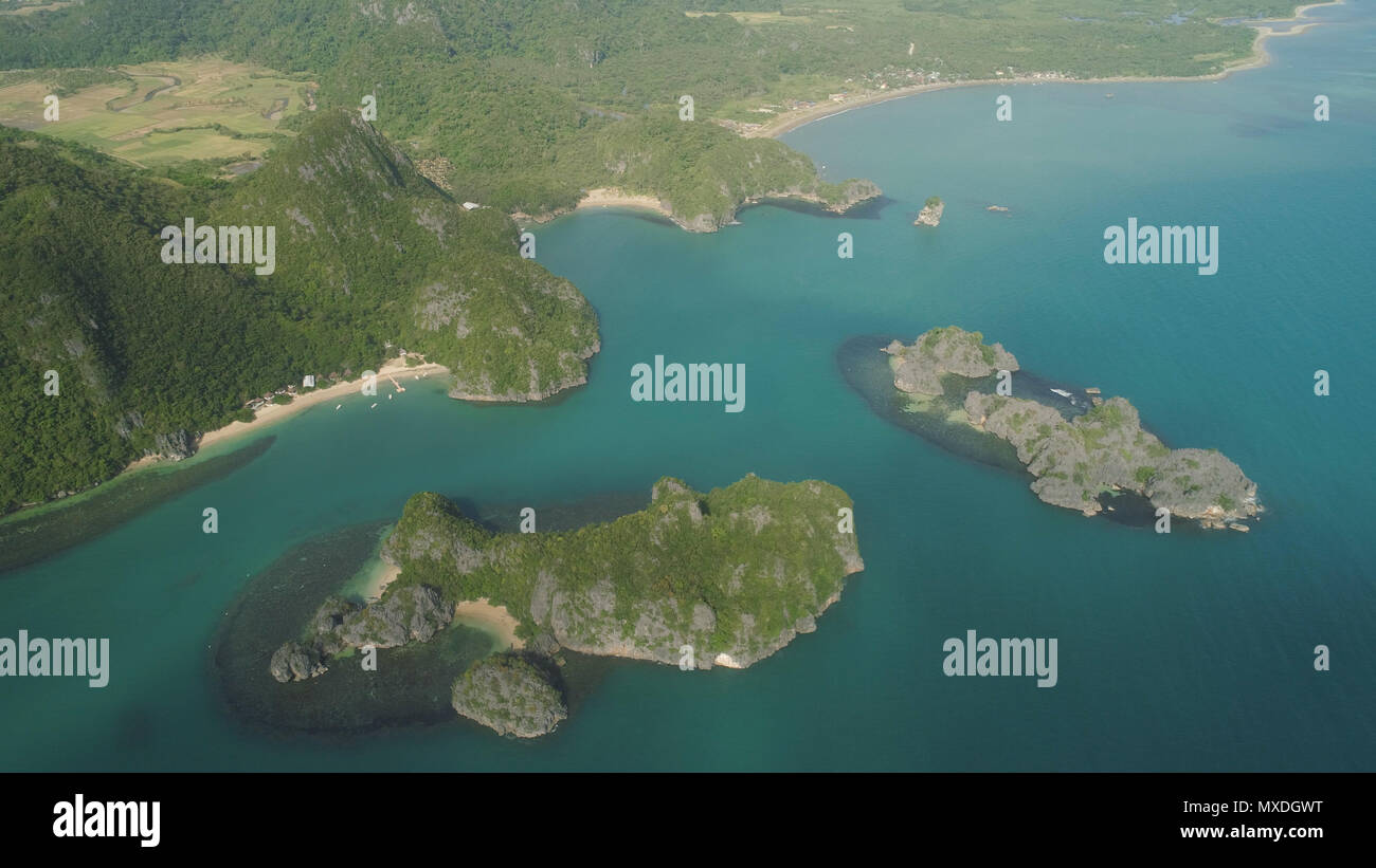 Aerial view island with sand beach and turquoise water in blue lagoon ...