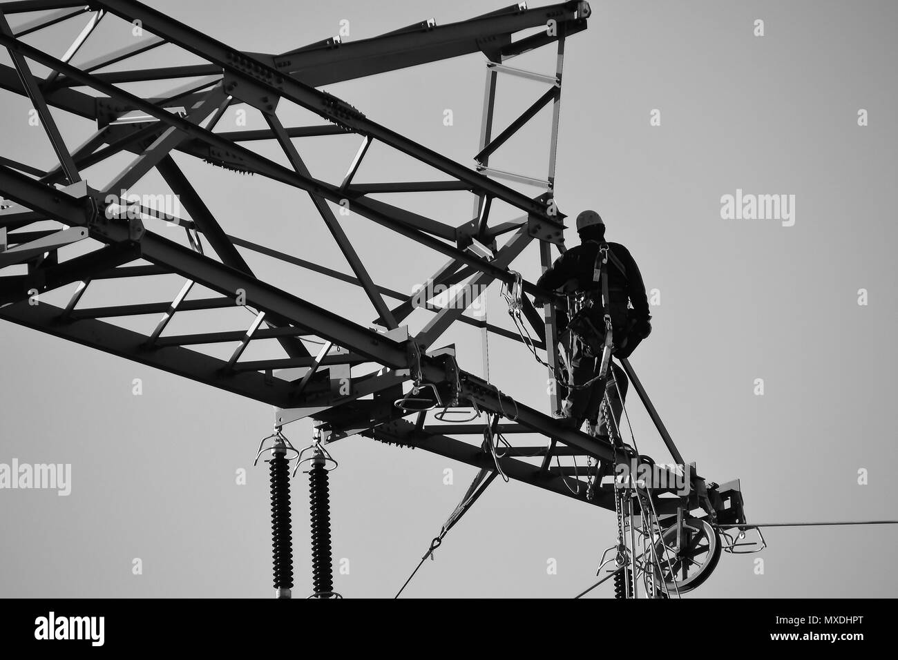 Fitter on a new power pole on the field Stock Photo - Alamy