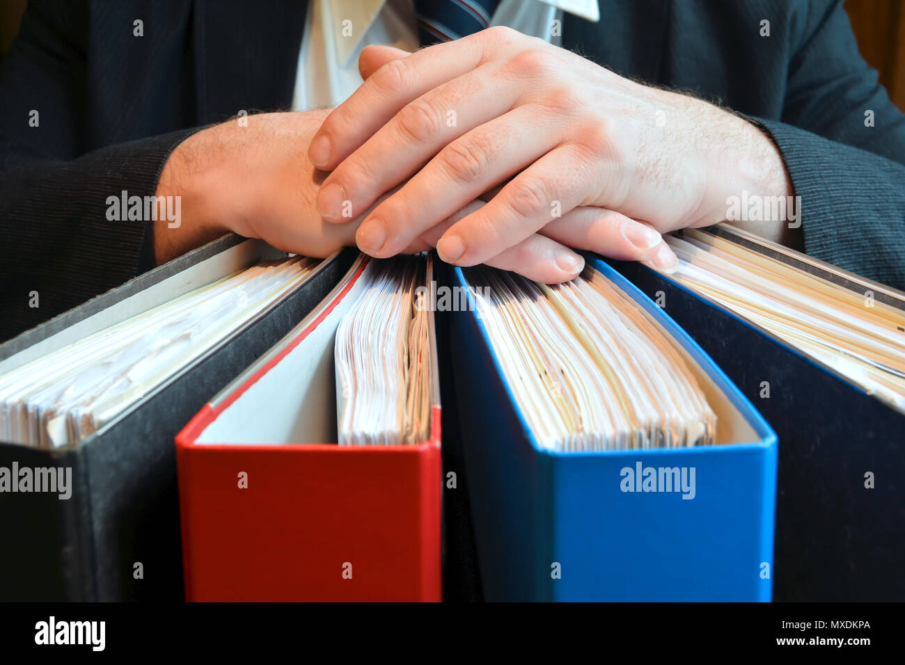 Office worker with some file folders Stock Photo - Alamy