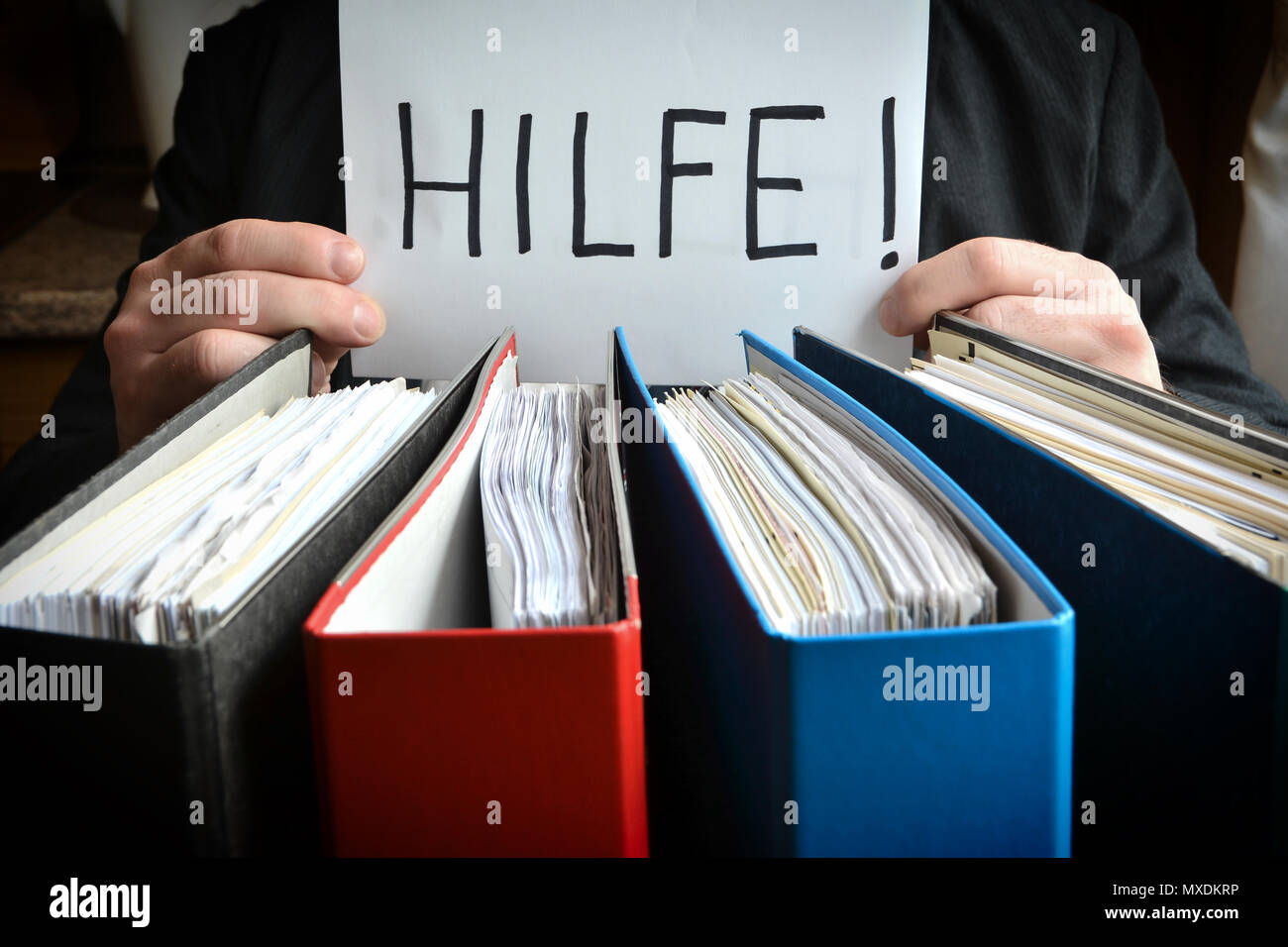 Office worker and a sign saying "Help Stock Photo - Alamy