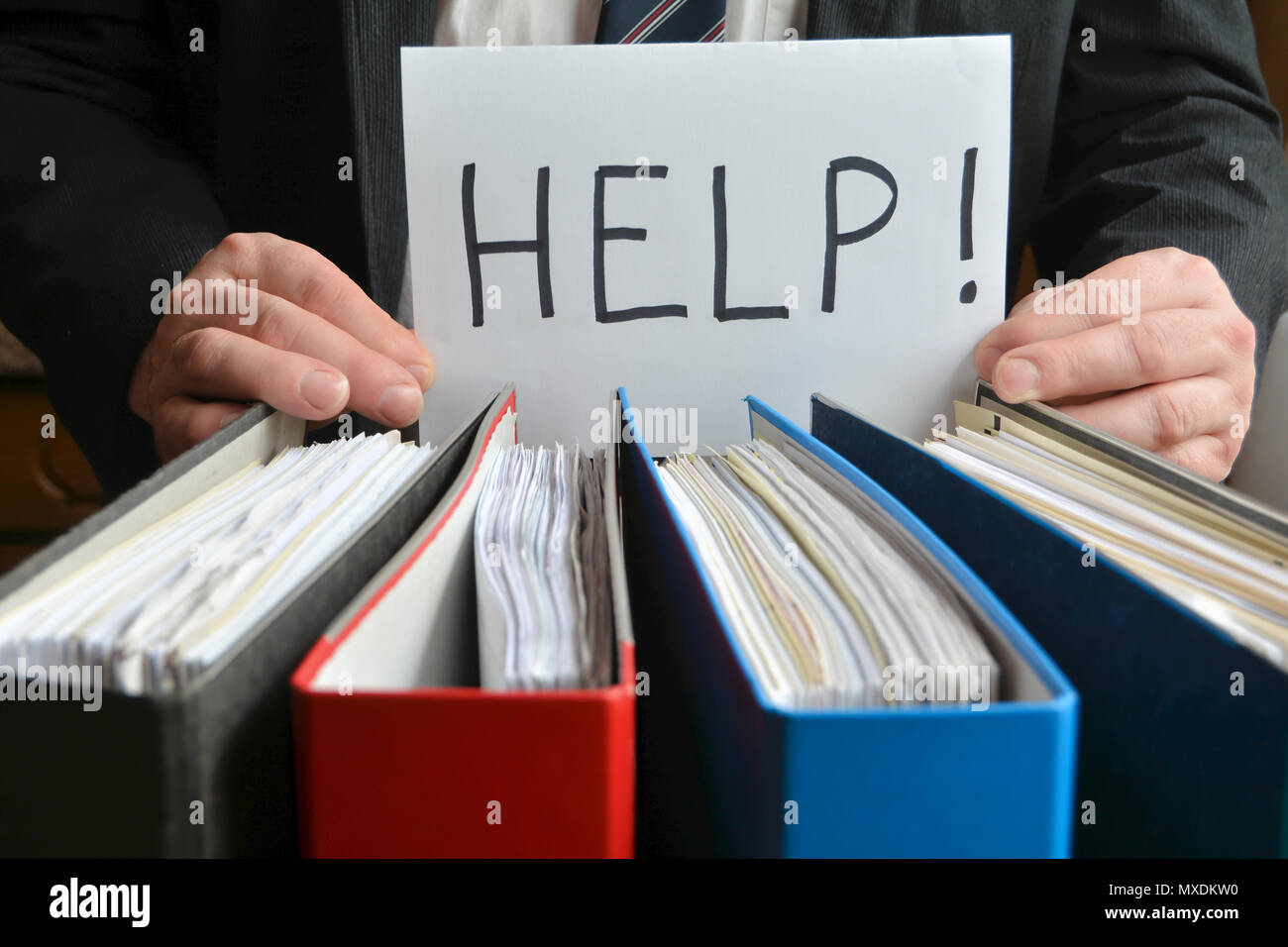 Office worker and a sign saying "Help Stock Photo - Alamy