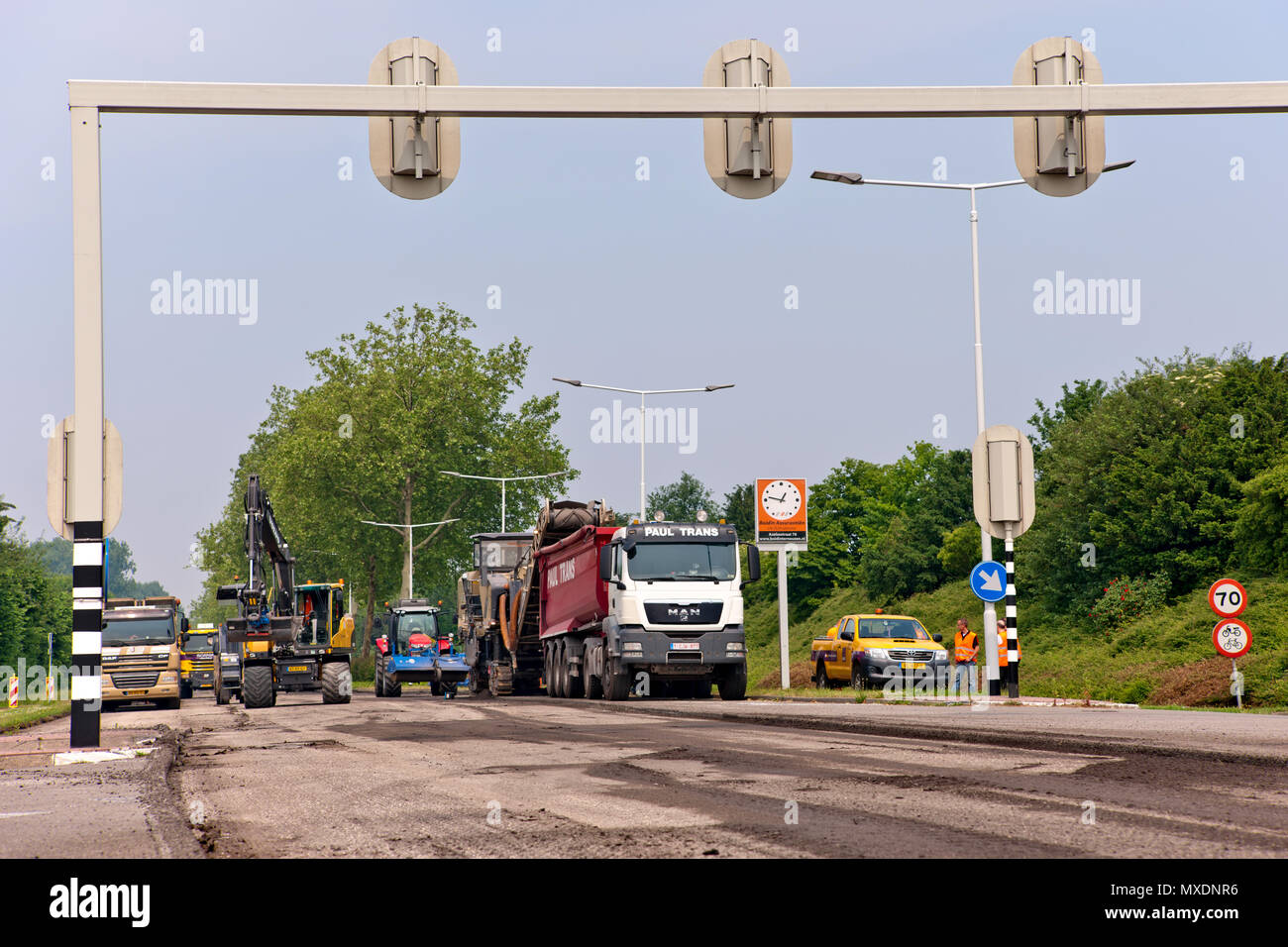 various vehicles are busy with road works Stock Photo - Alamy