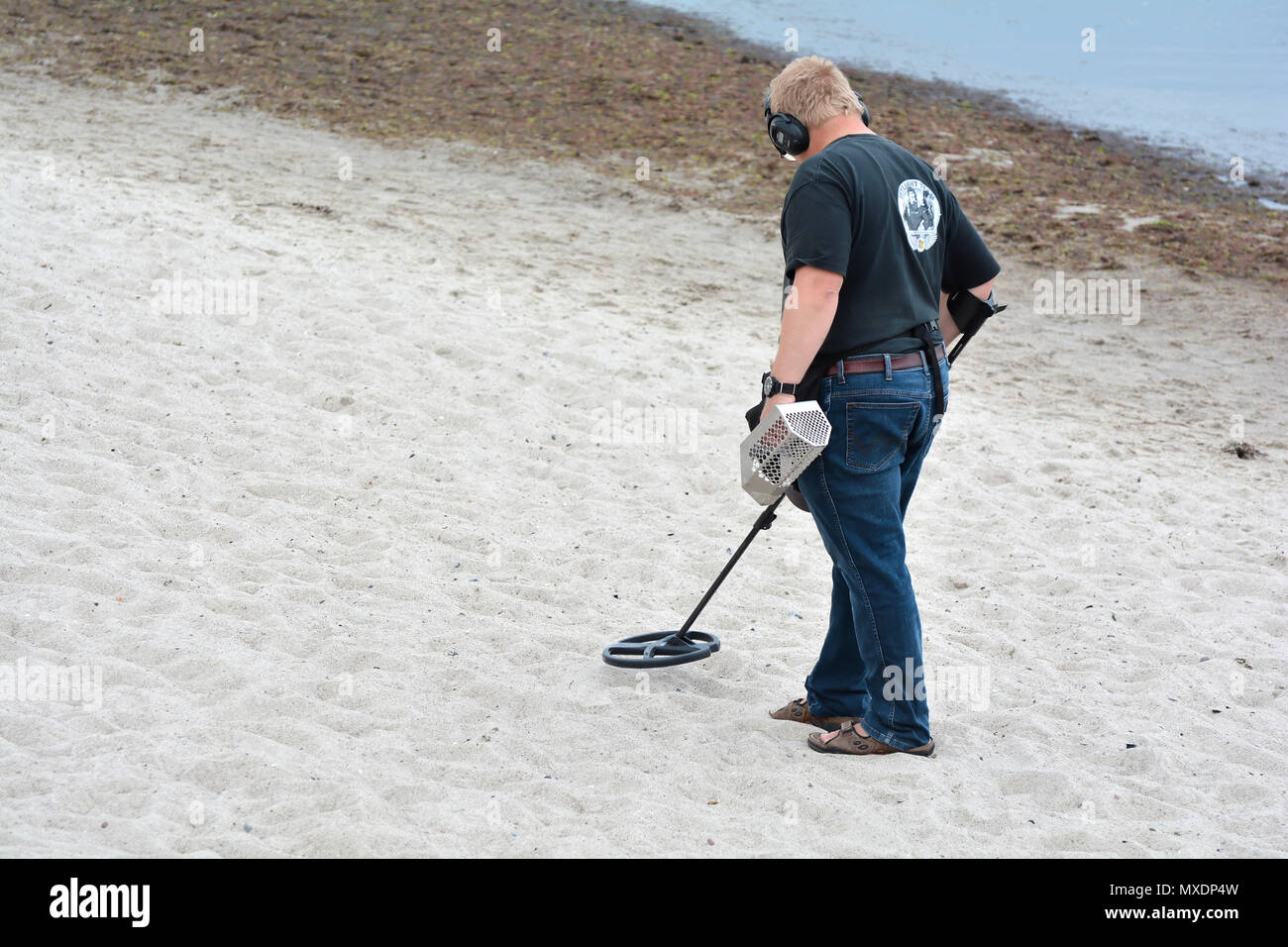 Treasure hunter on the beach of the Baltic Sea Stock Photo - Alamy