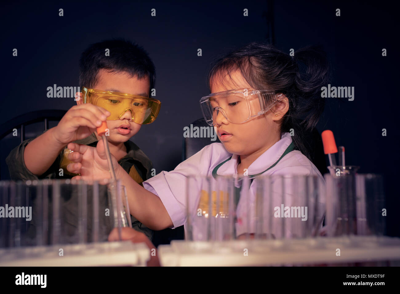 asian children in science examination laboratory Stock Photo - Alamy