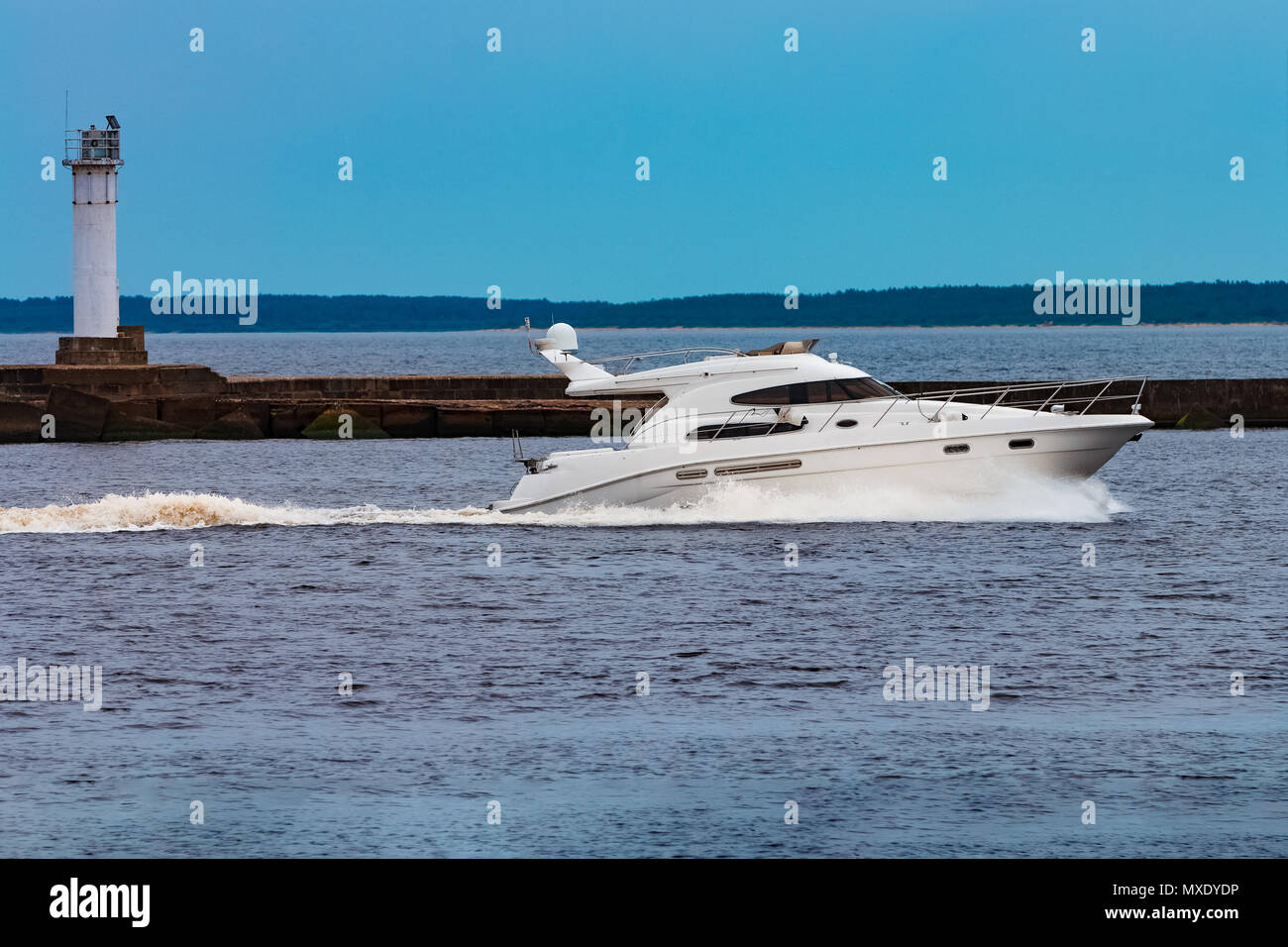 White speed boat moving fast to the Baltic sea. Water sport Stock Photo ...