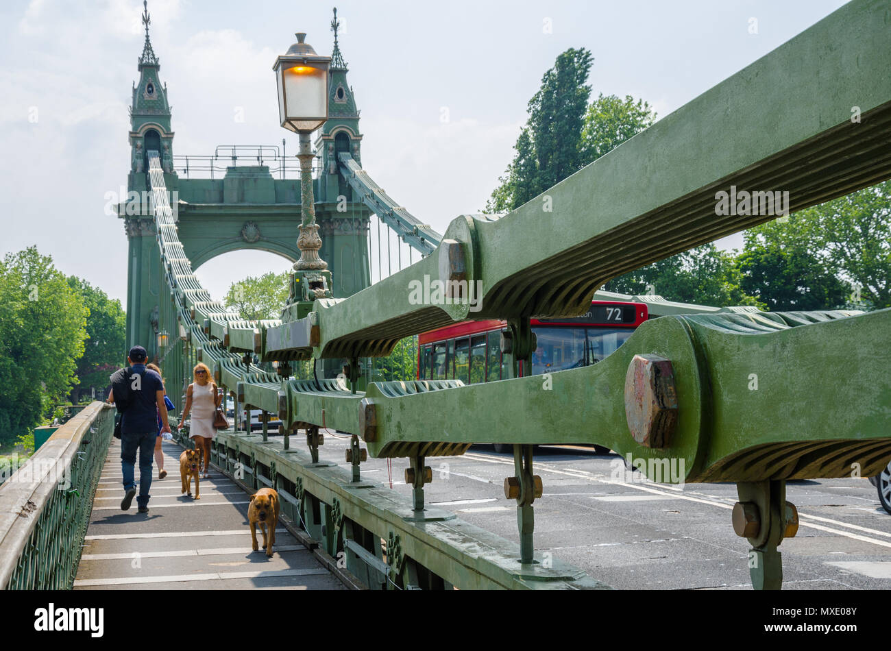 Traffic And Pedestrians On Hammersmith Suspension Bridge In London Uk