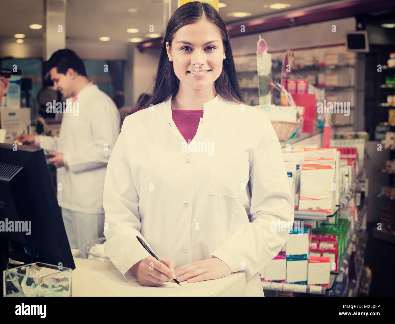 Friendly pharmacist desk hi-res stock photography and images - Alamy