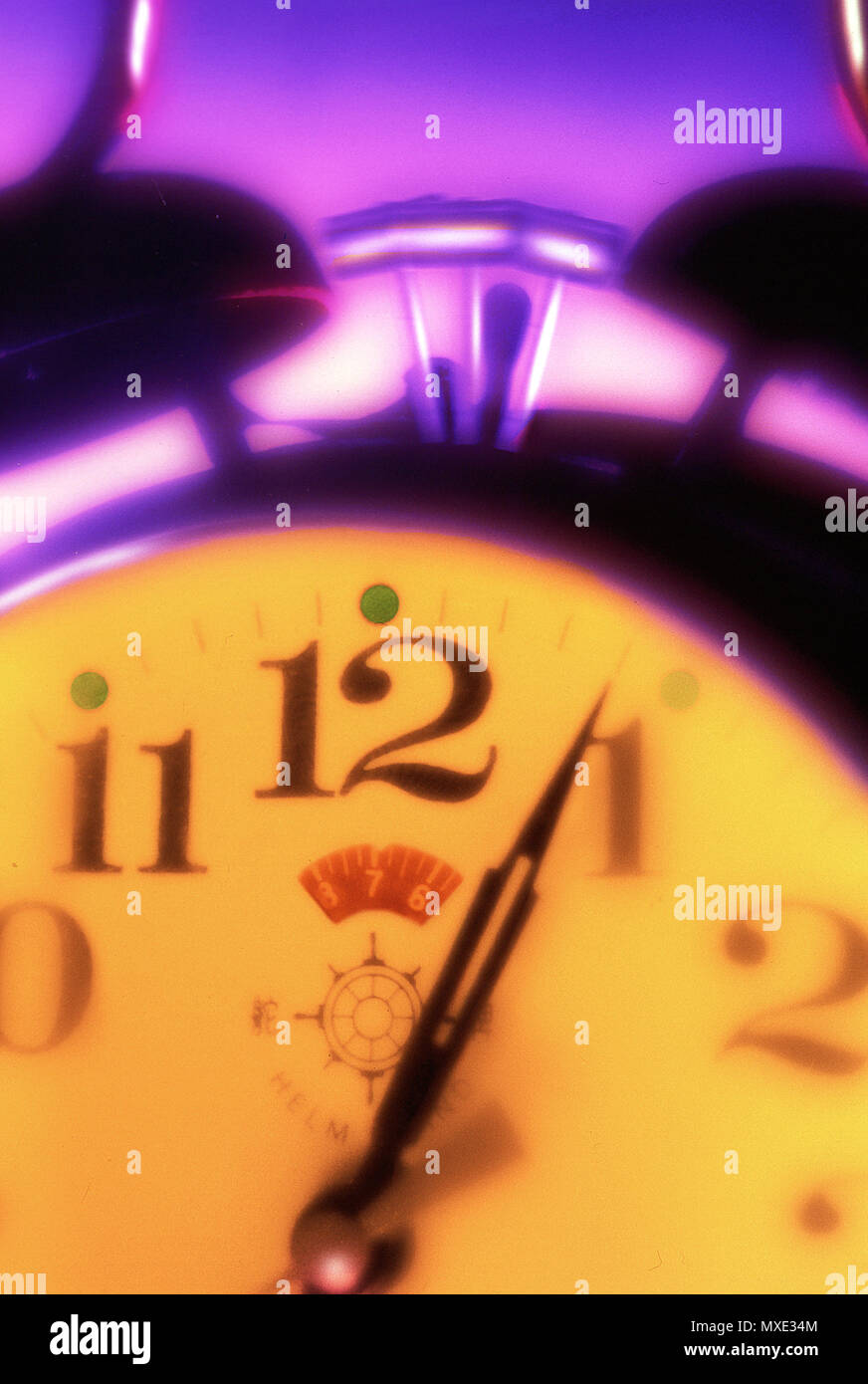 Early morning and a bell alarm clocks hammer strikes its bells Stock ...