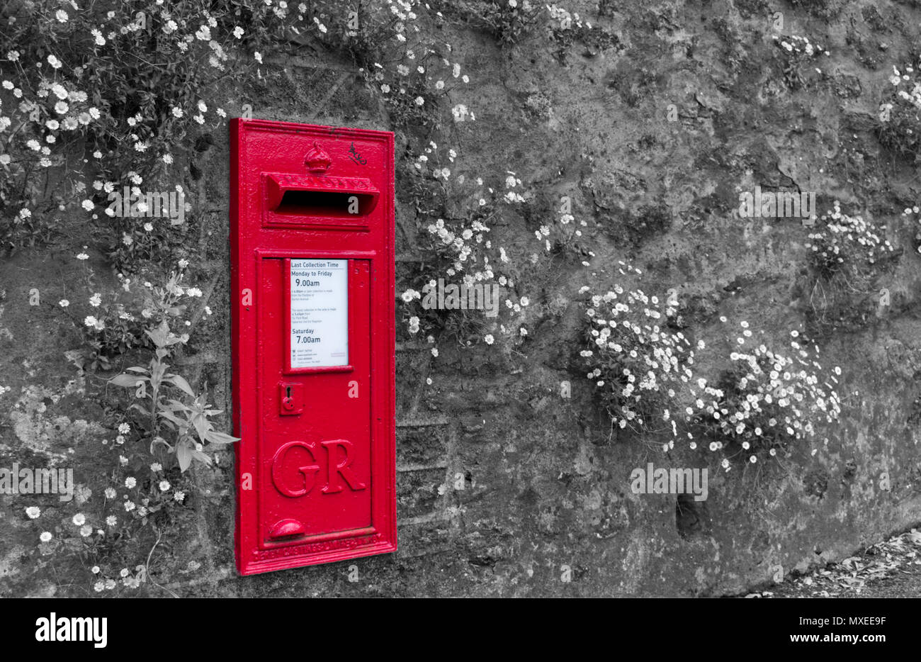 Red Post Box in Stone Wall England, UK Stock Photo - Alamy