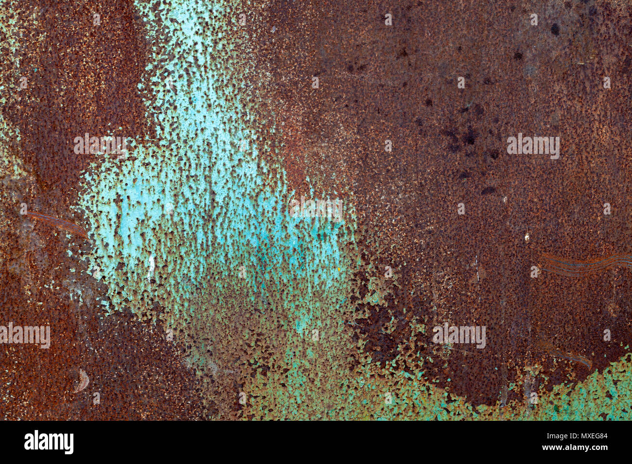 Old green grunge metal wall with big rust spots, close-up background ...
