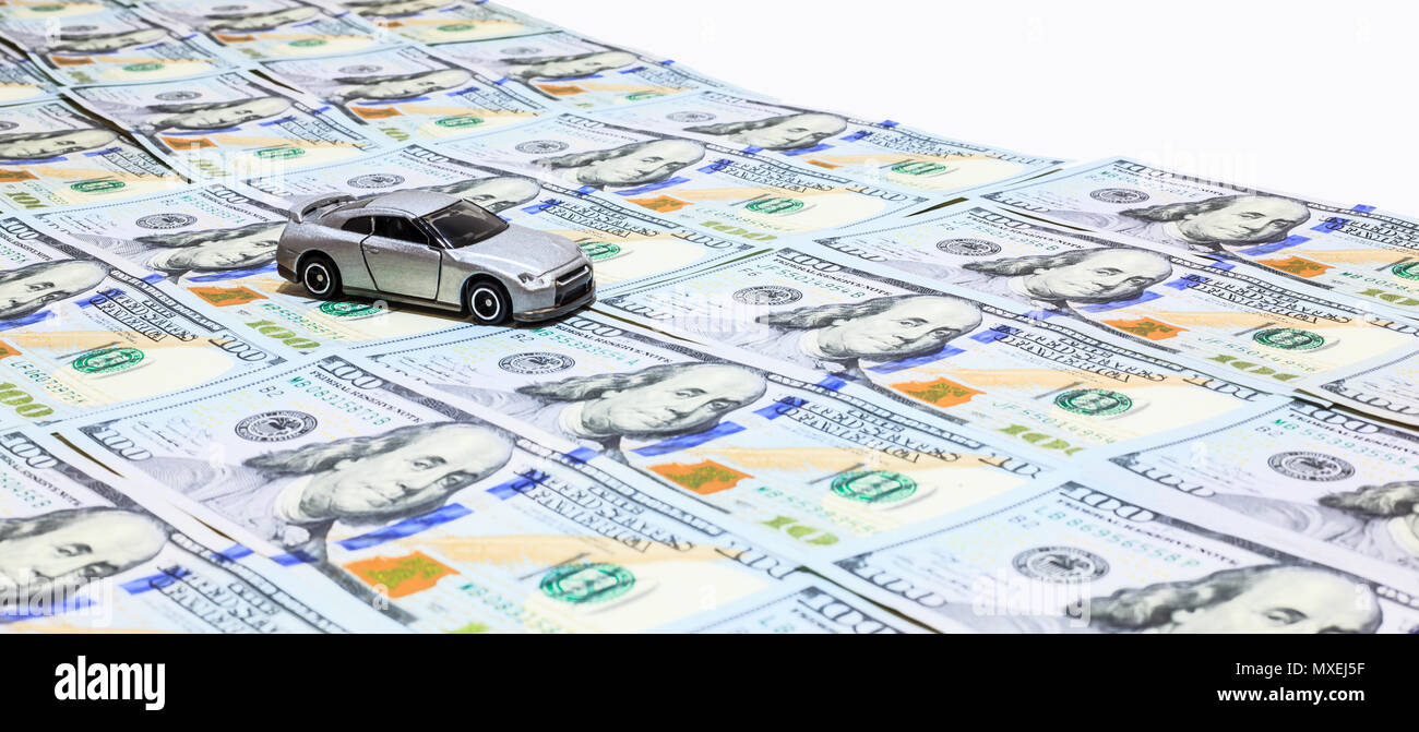 silver color car on the money road isolated on white background with ...