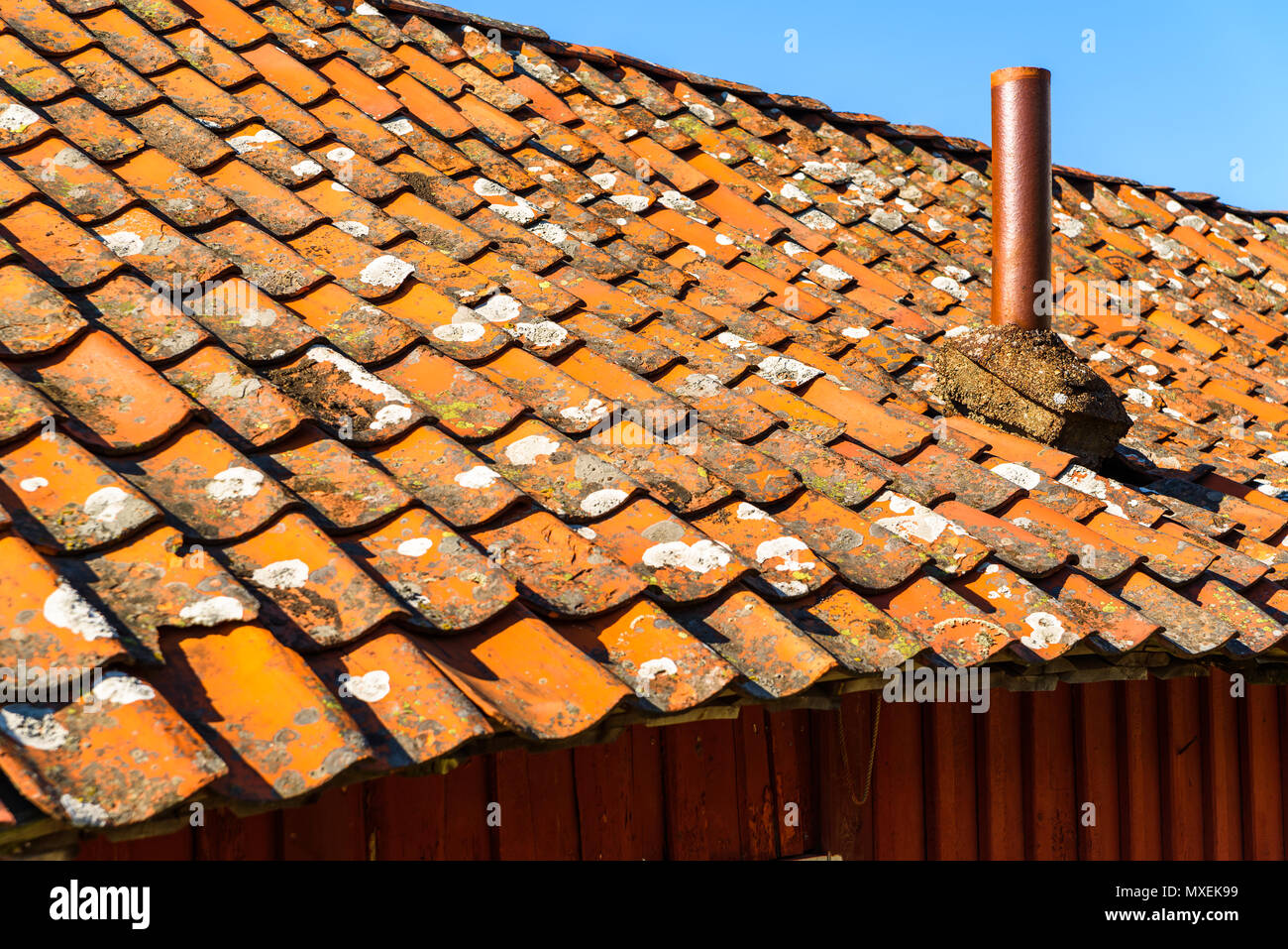 Small chimney on an old tiled roof Stock Photo - Alamy