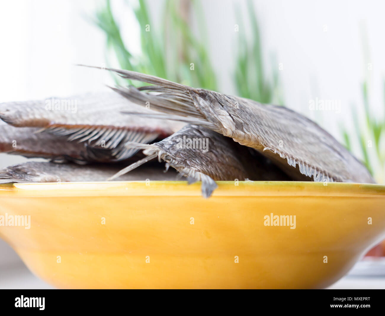 The Dried Fish on a color background Stock Photo - Alamy