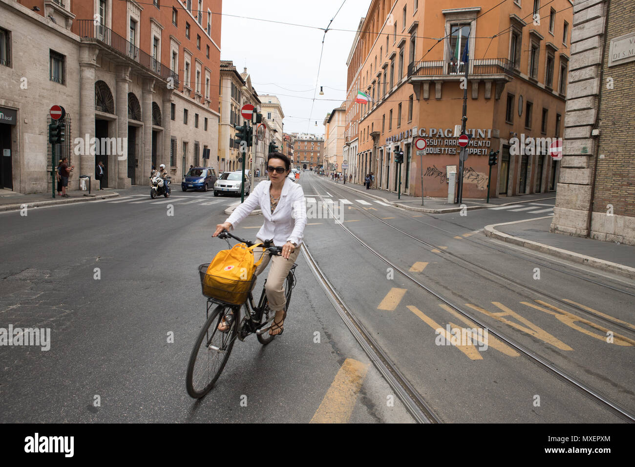 Woman cycling in rome hi-res stock photography and images - Alamy