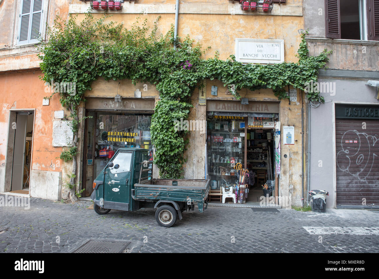 Rome Italy, Old shop in Via dei Banchi vecchi, old tree wheels vehicle ...