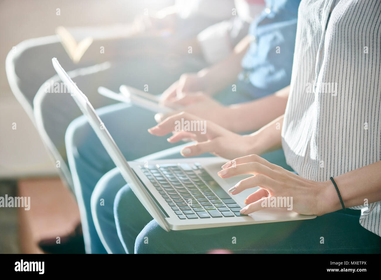 Using laptop at work Stock Photo - Alamy