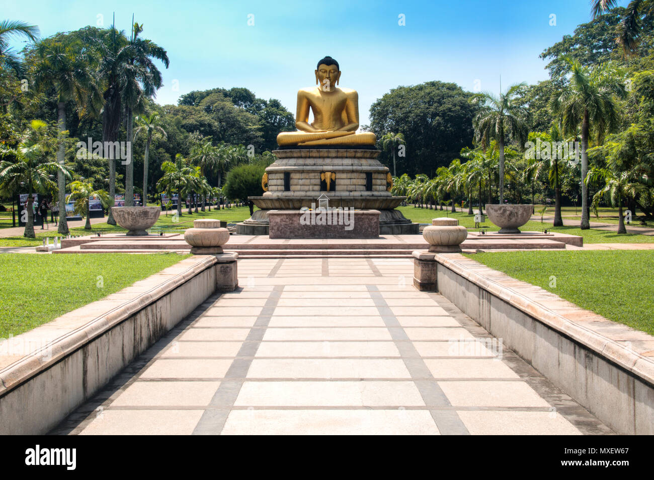 The golden buddha statue in the Viharamahadevi park in the center of ...