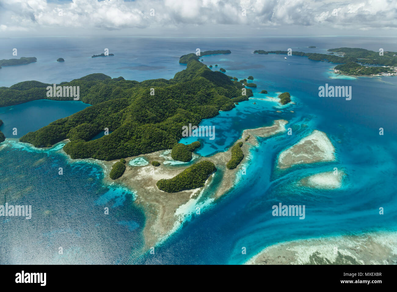 Aerial view of a channel between atoll islands and coral reefs in the ...