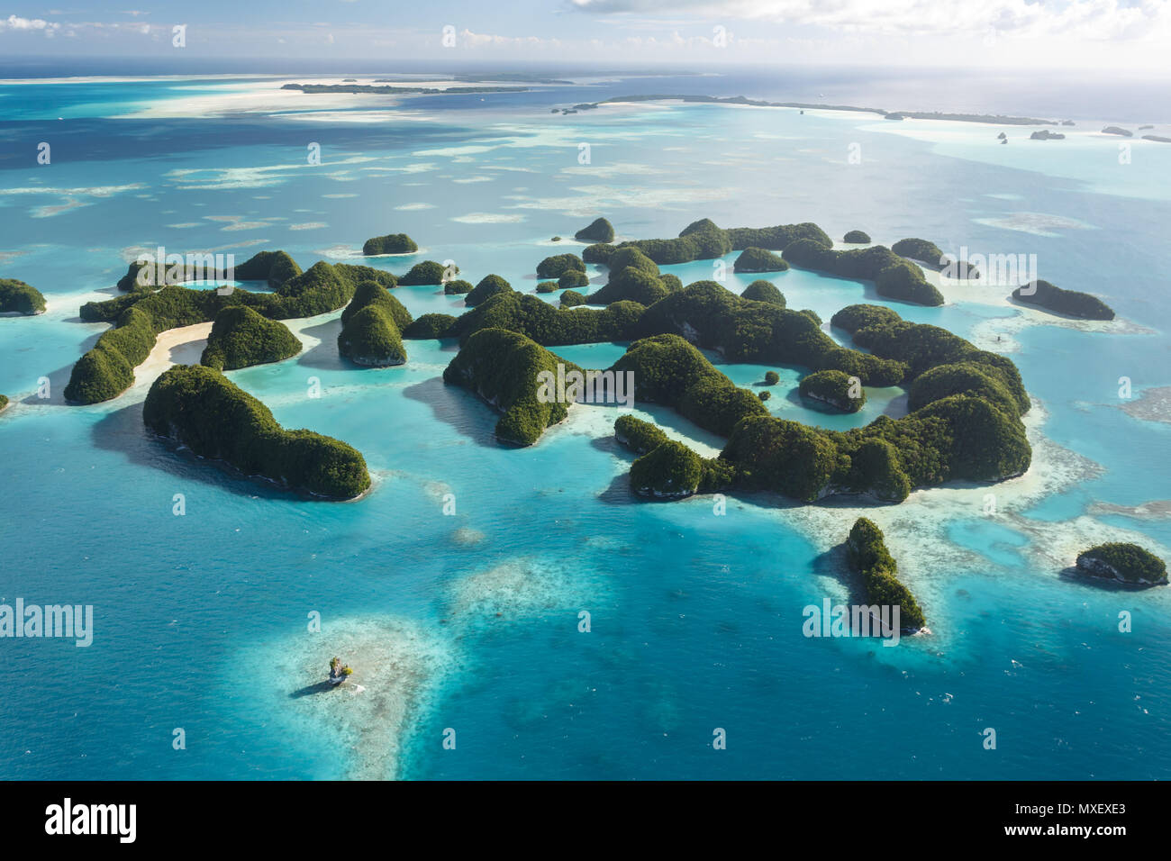 Aerial view of coral reefs, coral atolls, and islands surrounded by the ...