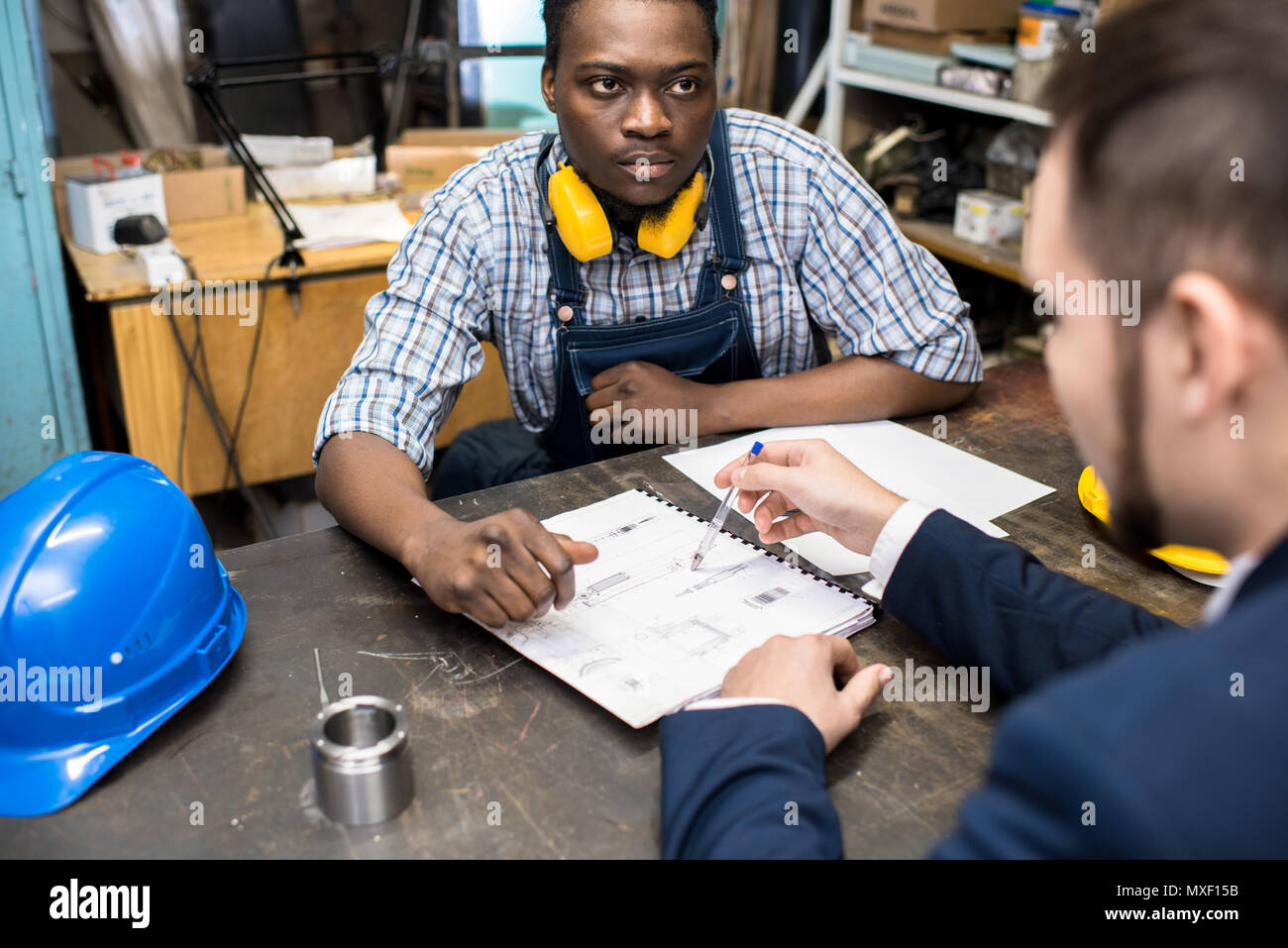 Having Discussion at Production Department Stock Photo - Alamy