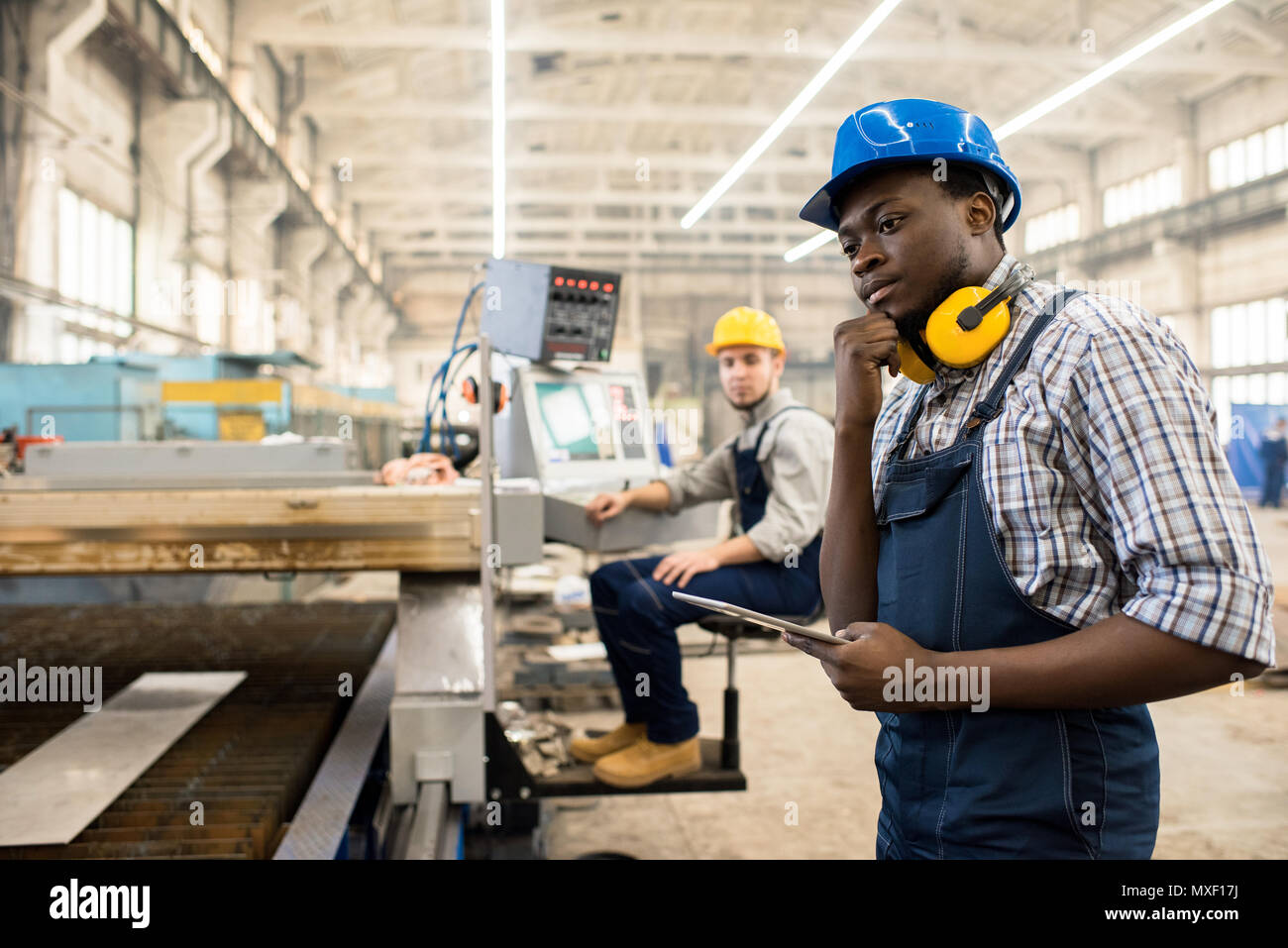 Operating Machine with Digital Tablet Stock Photo - Alamy
