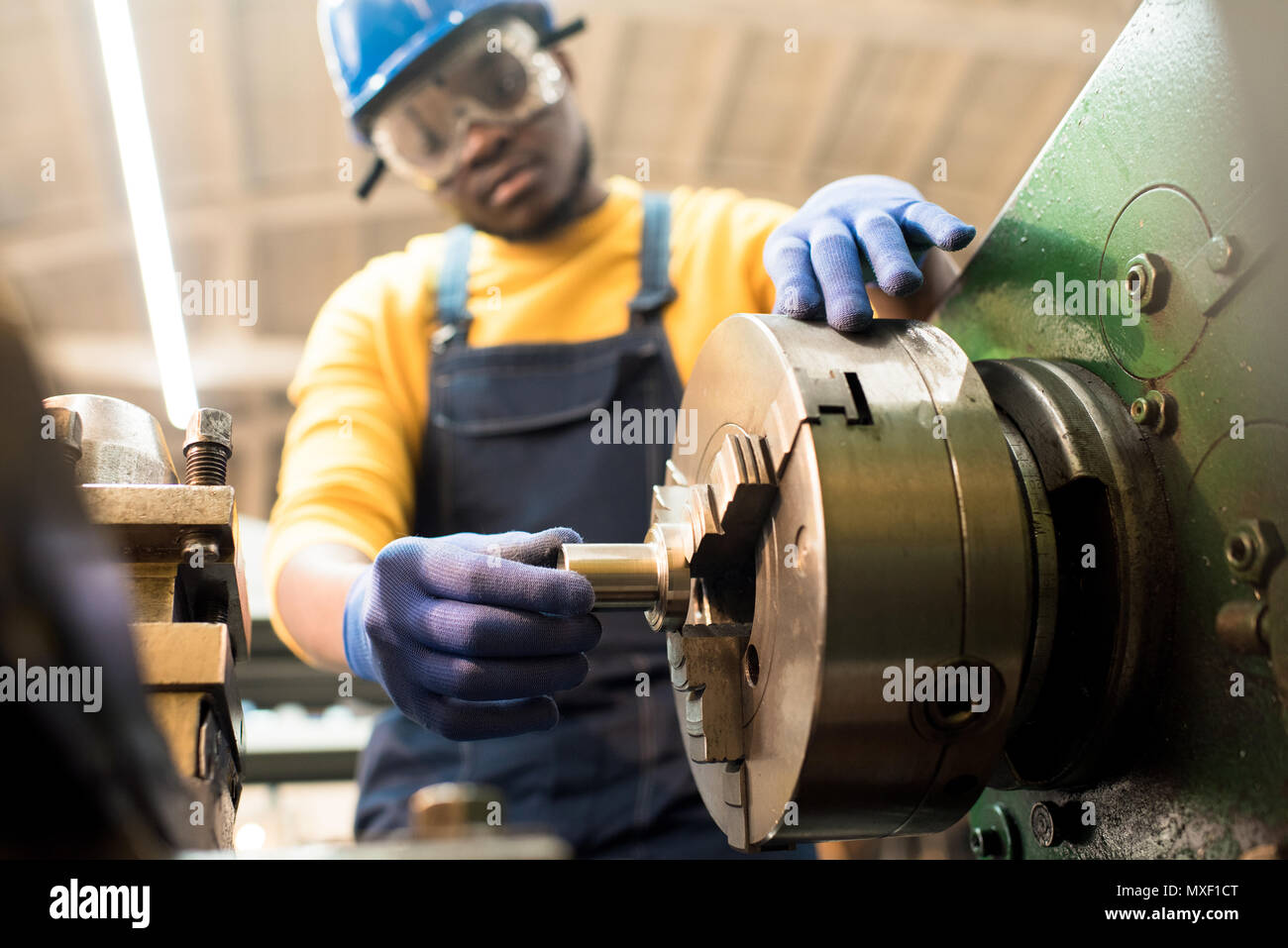 Machine Operator Adjusting Equipment Stock Photo - Alamy