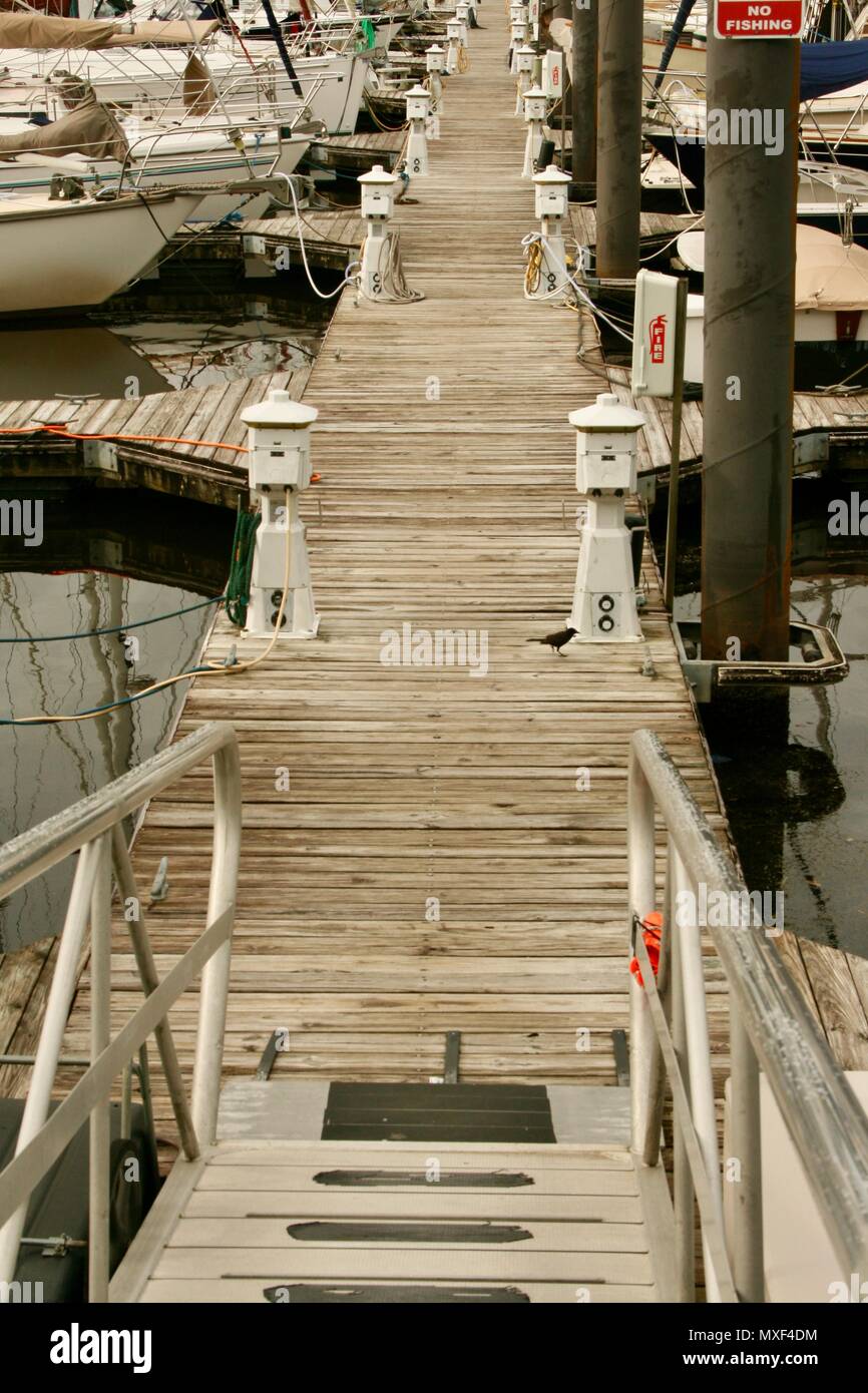 Dock entrance in a harbor Stock Photo - Alamy