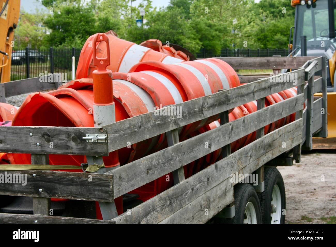 Orange and white construction road barrels Stock Photo - Alamy