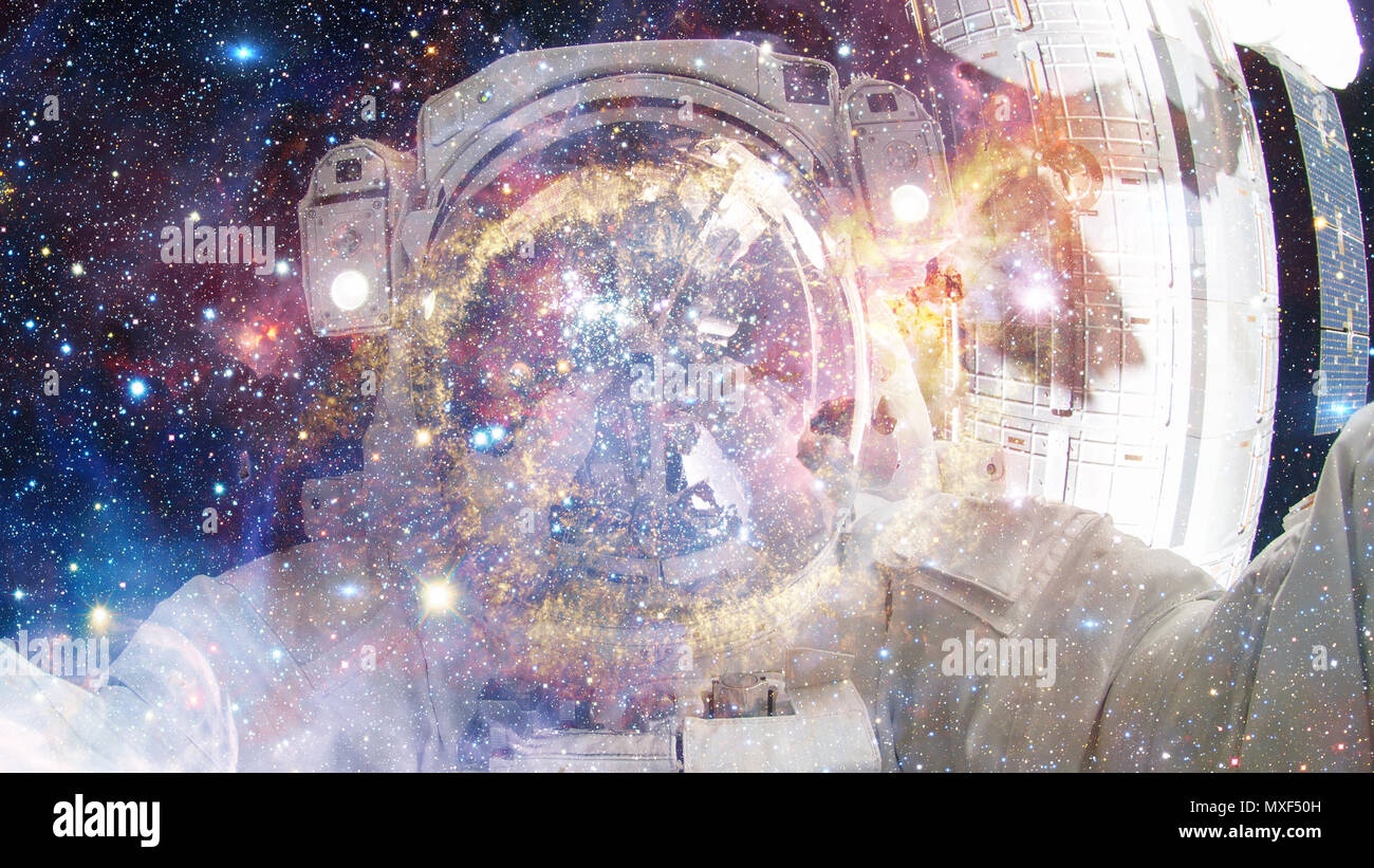 Astronaut in outer space. Science fiction art. Elements of this image ...