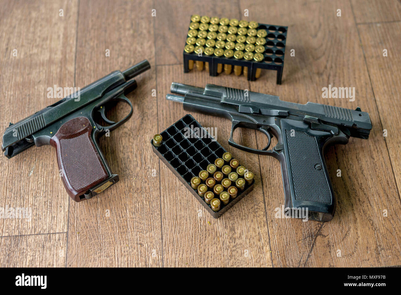 Two pistols and ammunition packs Stock Photo - Alamy