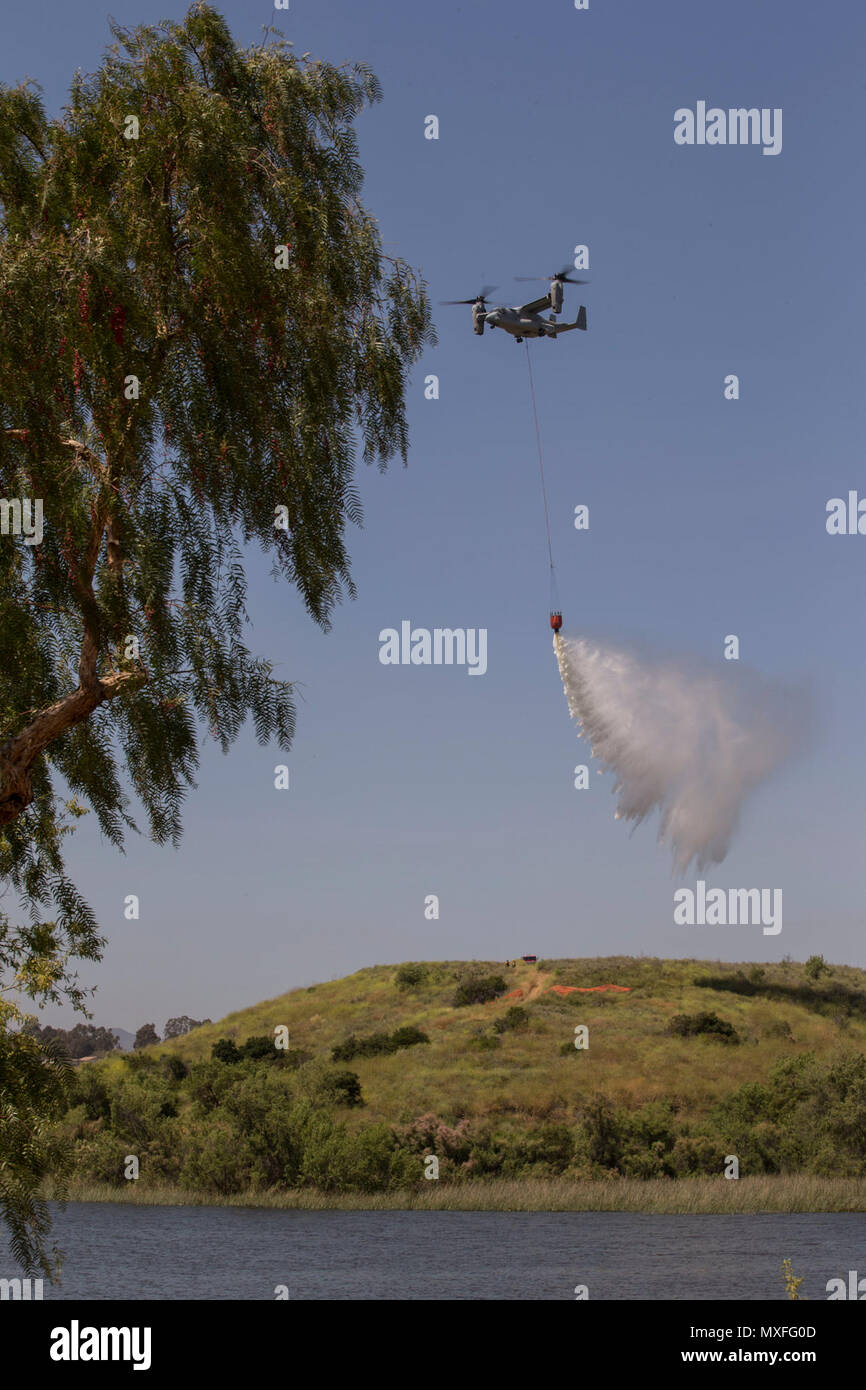 An MV-22 Osprey drops water during the 2017 Wildland Firefighting ...