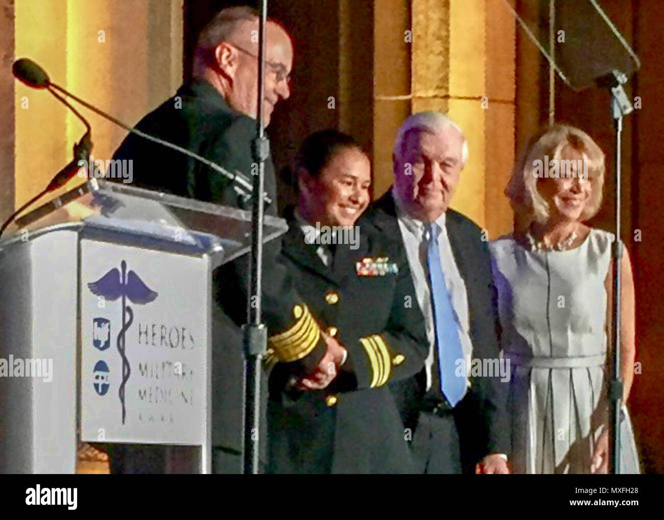 (May 4, 2017) -- Lt. Cmdr. Tatana Olson, center, is presented the ...