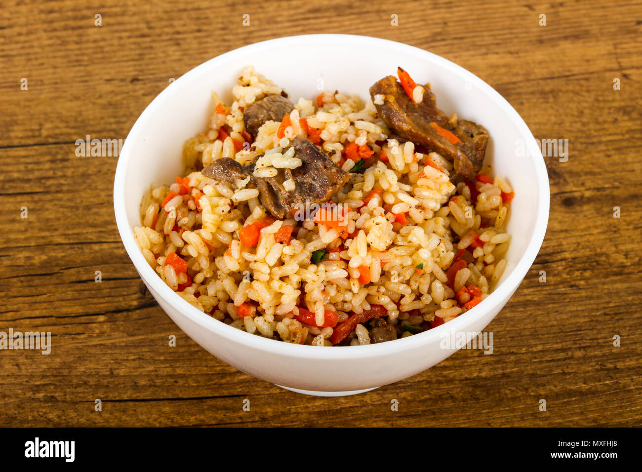 Asian rice - Plov with meat and carrot Stock Photo - Alamy