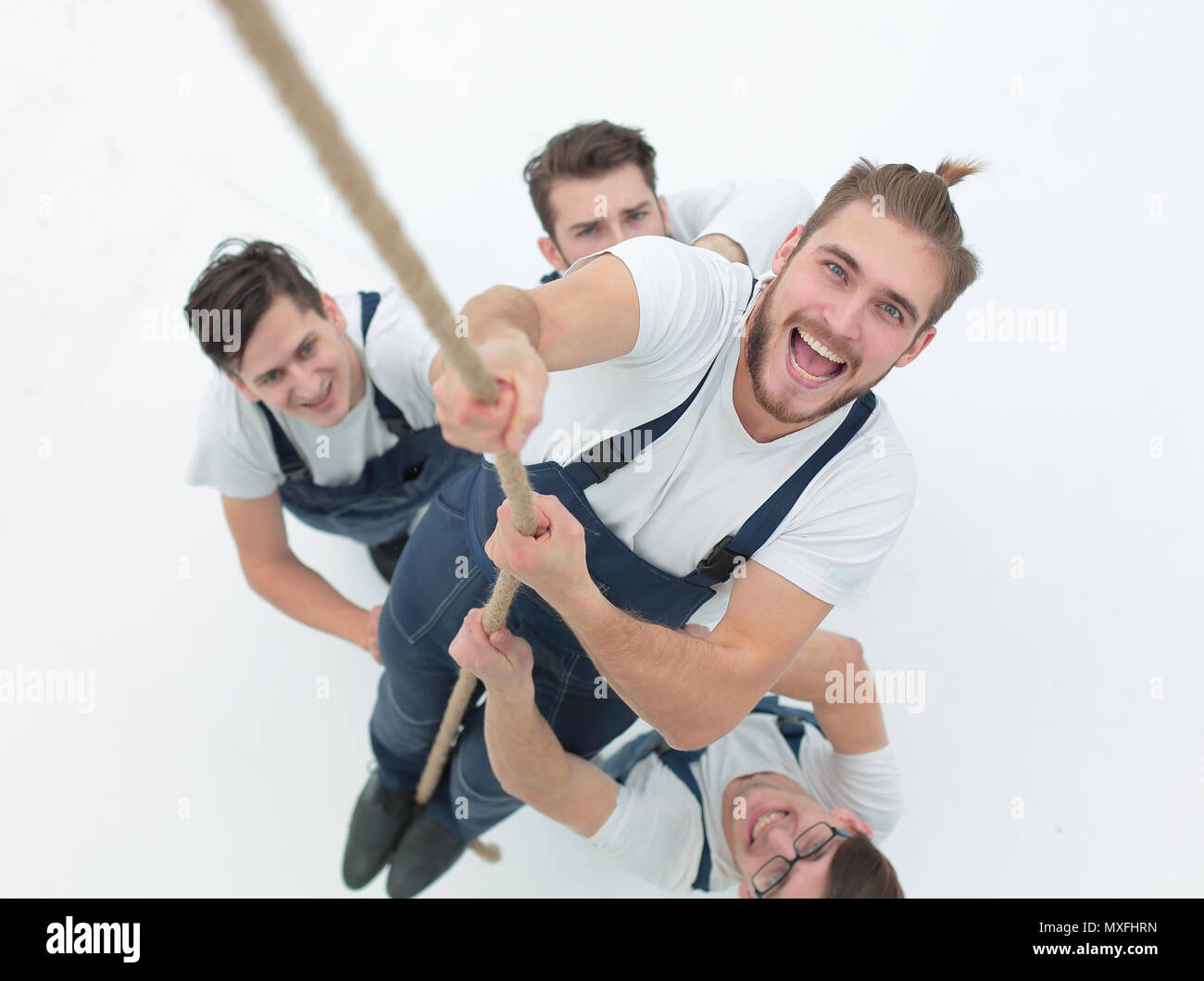 view from the top.smiling engineer ,climbing up the rope Stock Photo ...