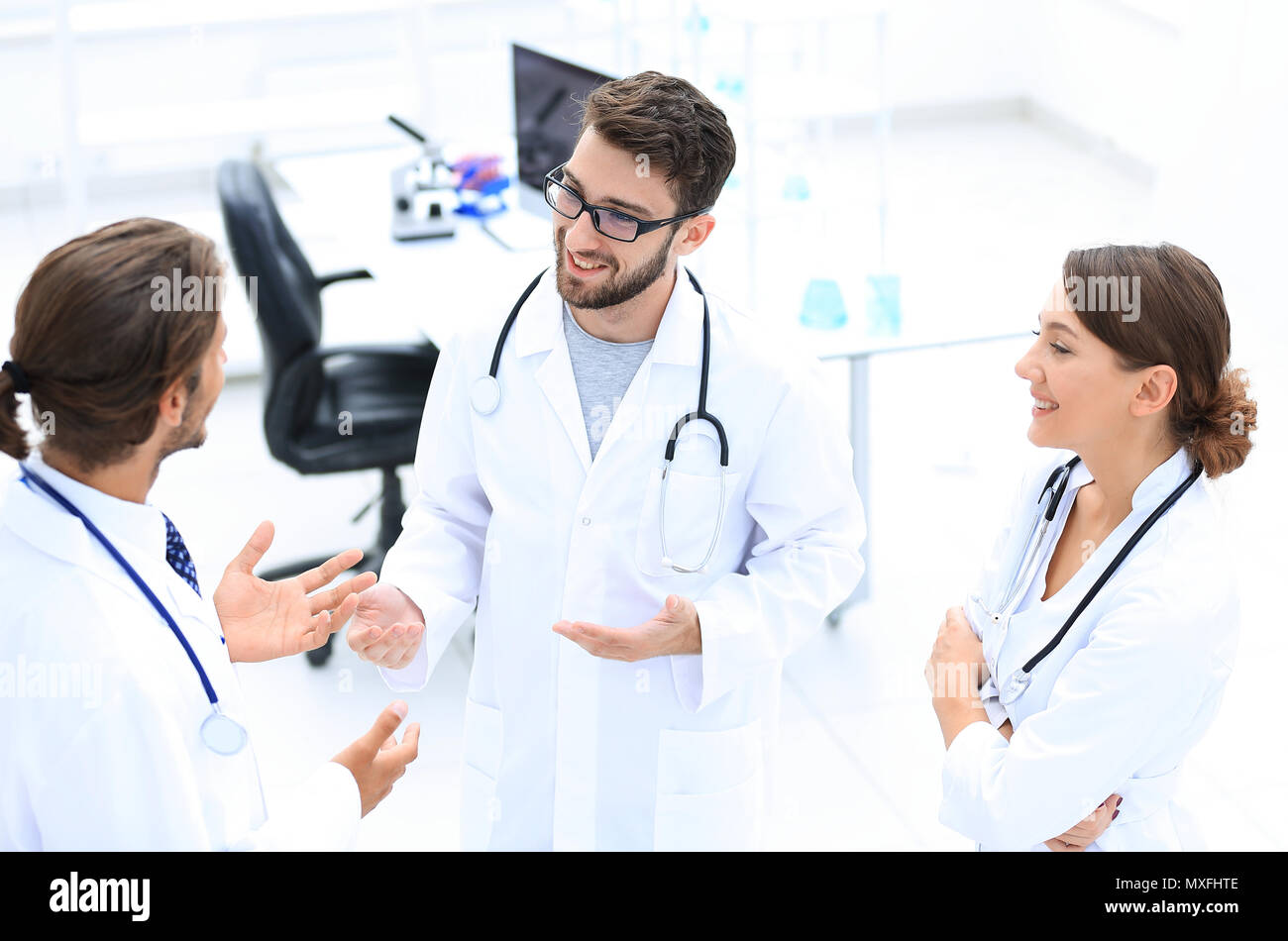 Group of doctors talking Stock Photo - Alamy