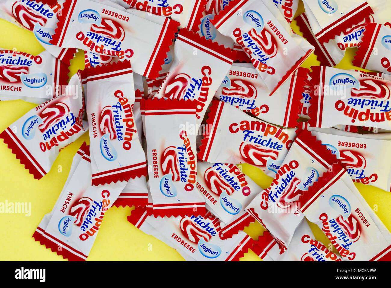 Campino boiled sweets, fruit and yogurt flavours, yellow background ...
