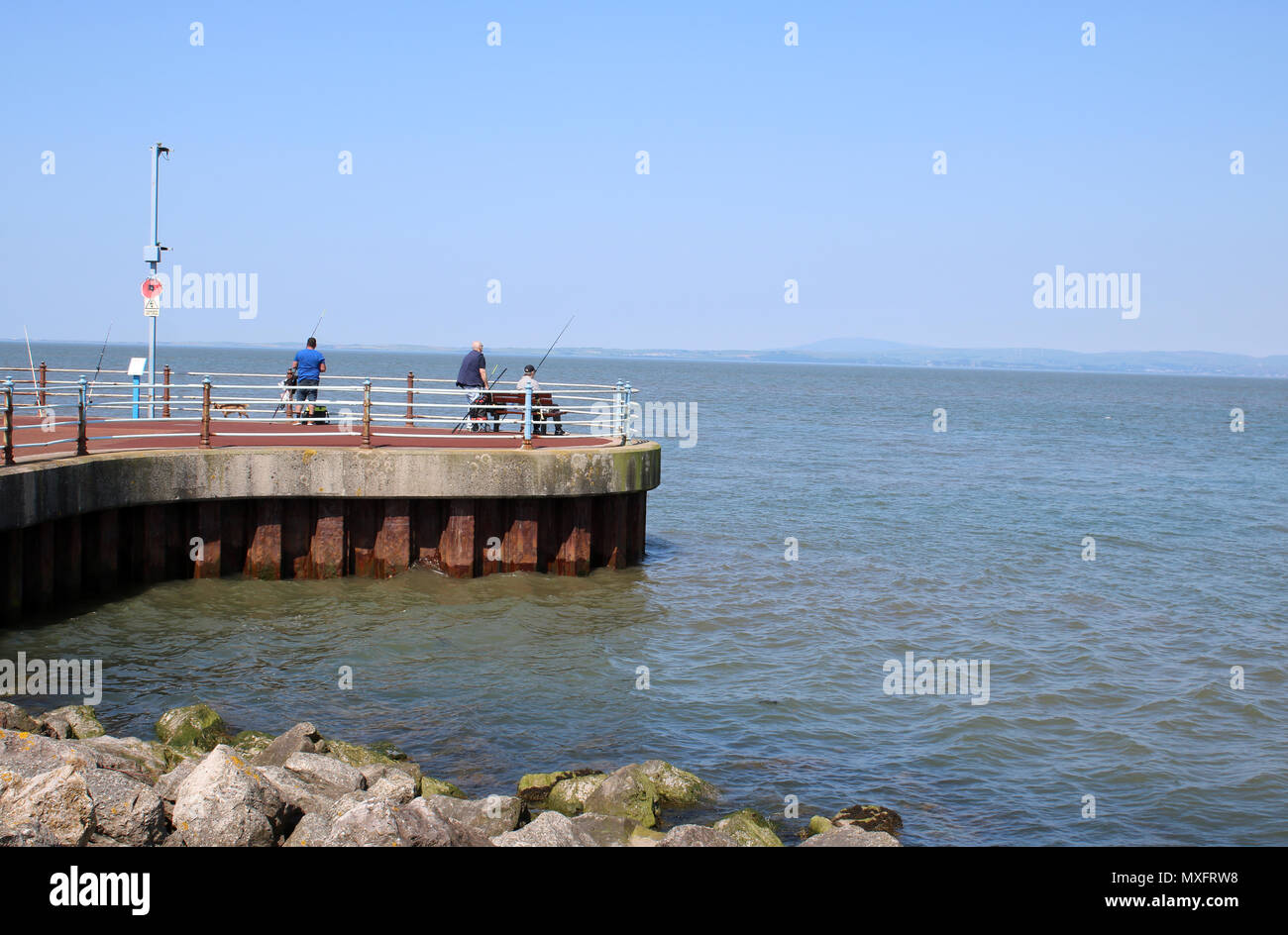 People on Trafalgar point, the extension to the Stone Jetty that juts ...