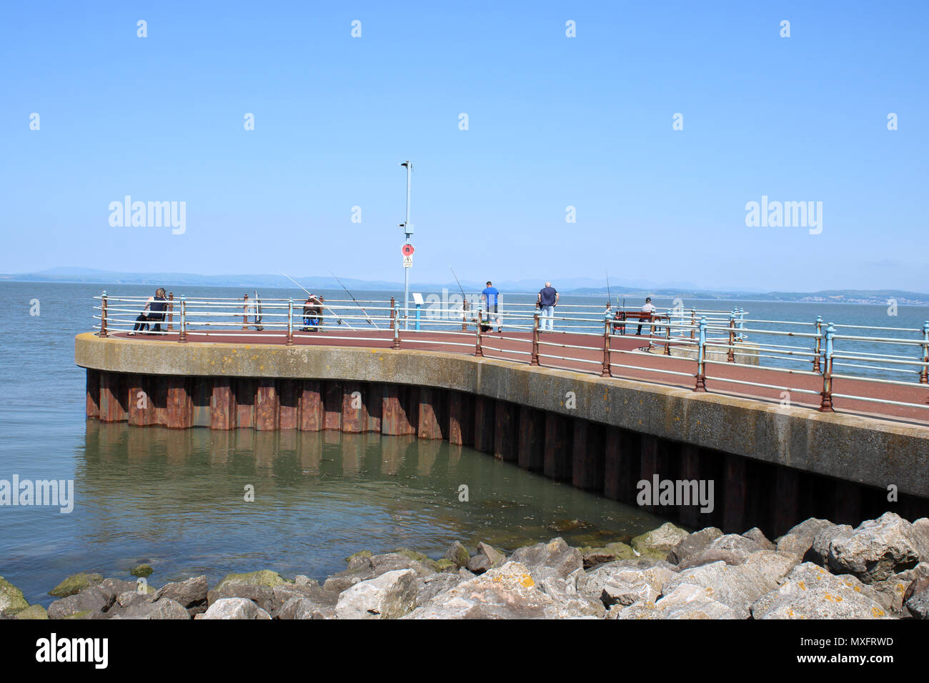 People on Trafalgar point, the extension to the Stone Jetty that juts ...