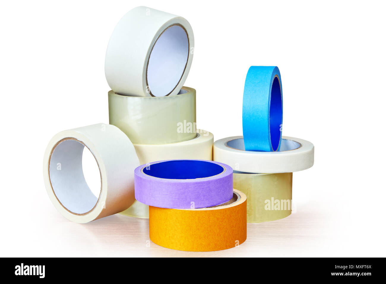 Stacks of transparent duct tape and multi-colored paper masking ...