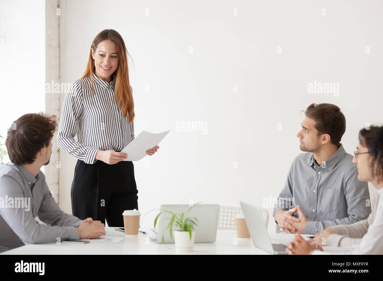 Female team leader presenting new project to colleagues at meeti Stock ...