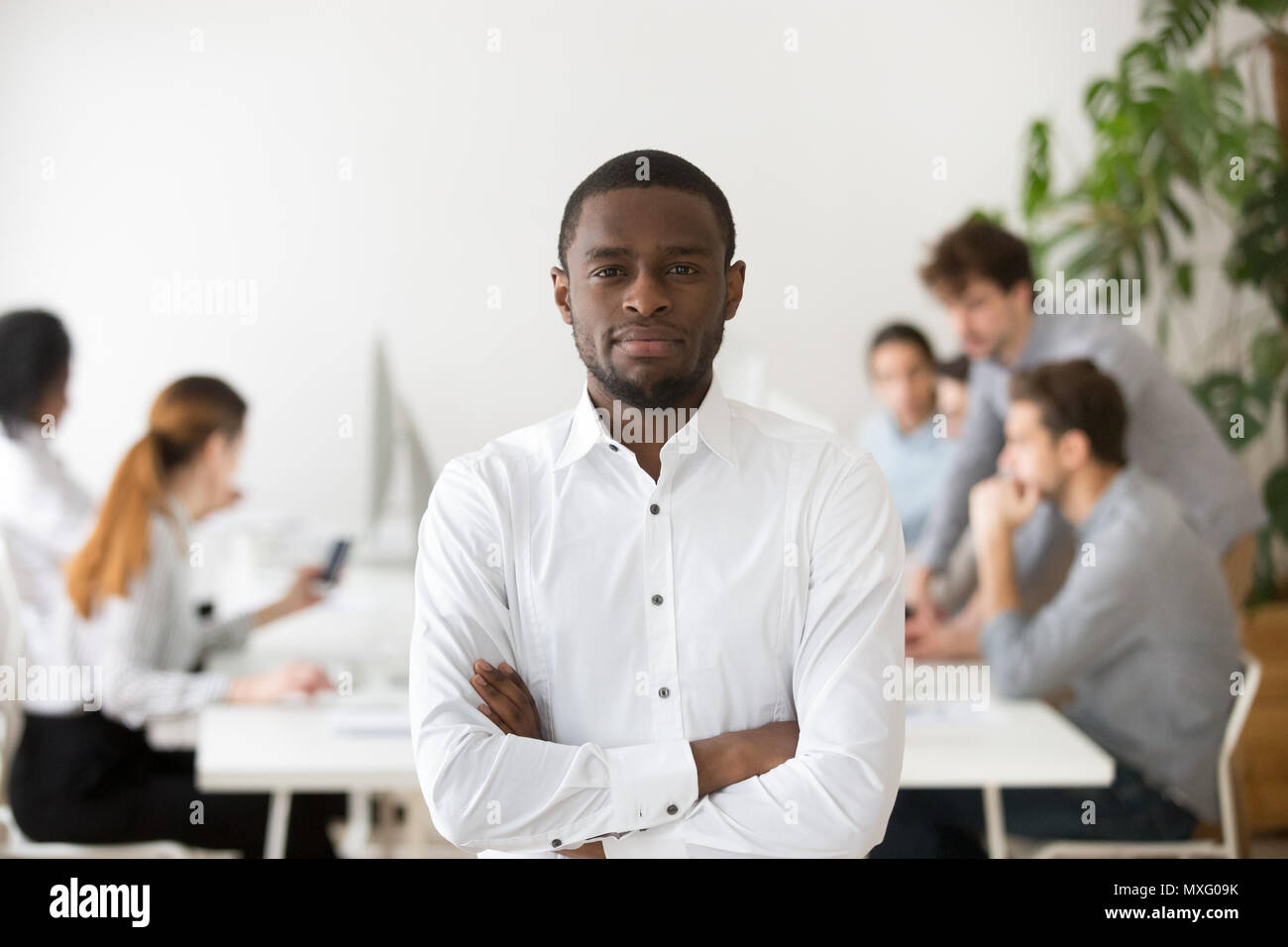 Portrait of confident black boss posing with arms crossed Stock Photo ...