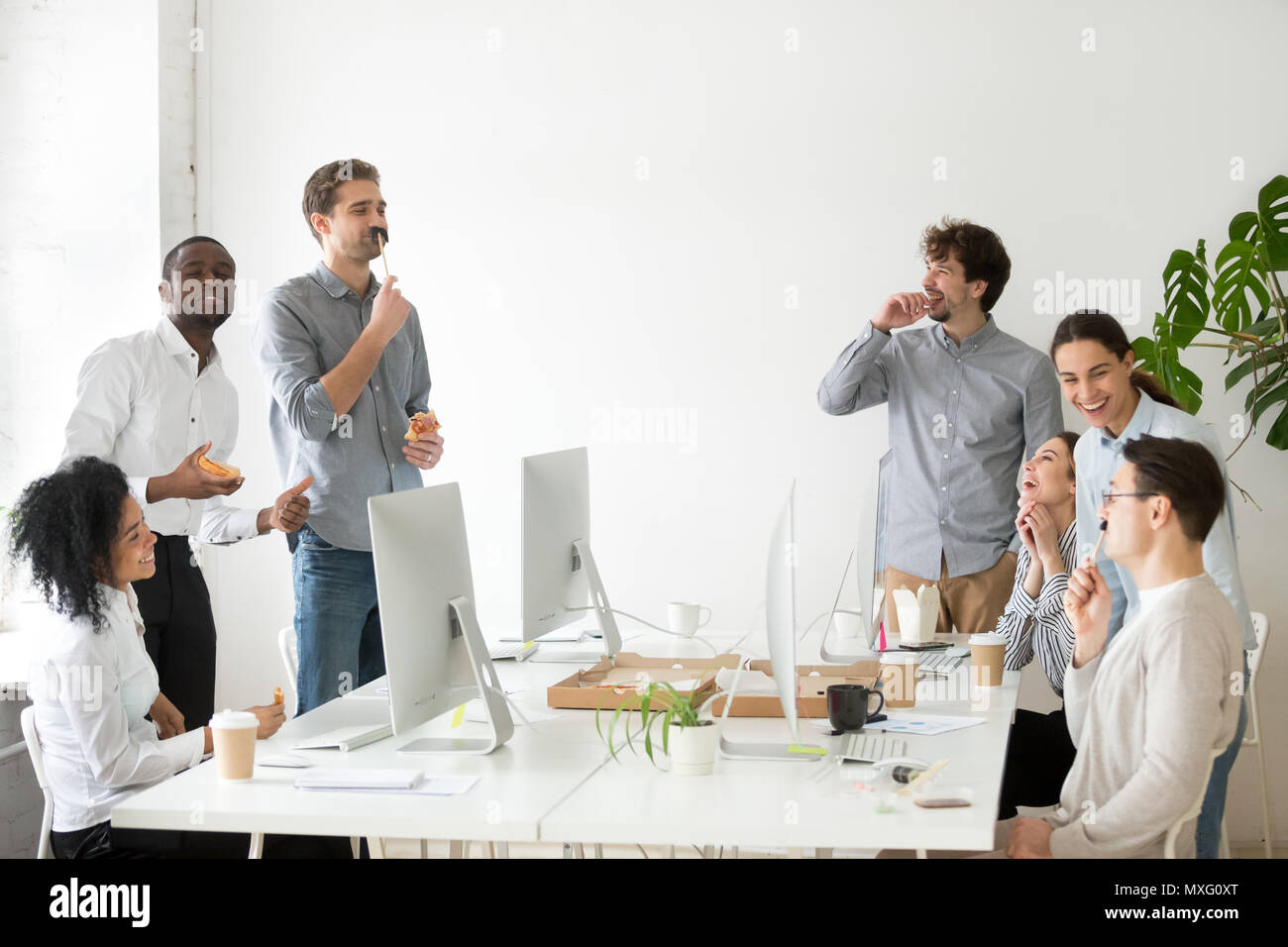 Friendly diverse team having fun during lunch break Stock Photo - Alamy